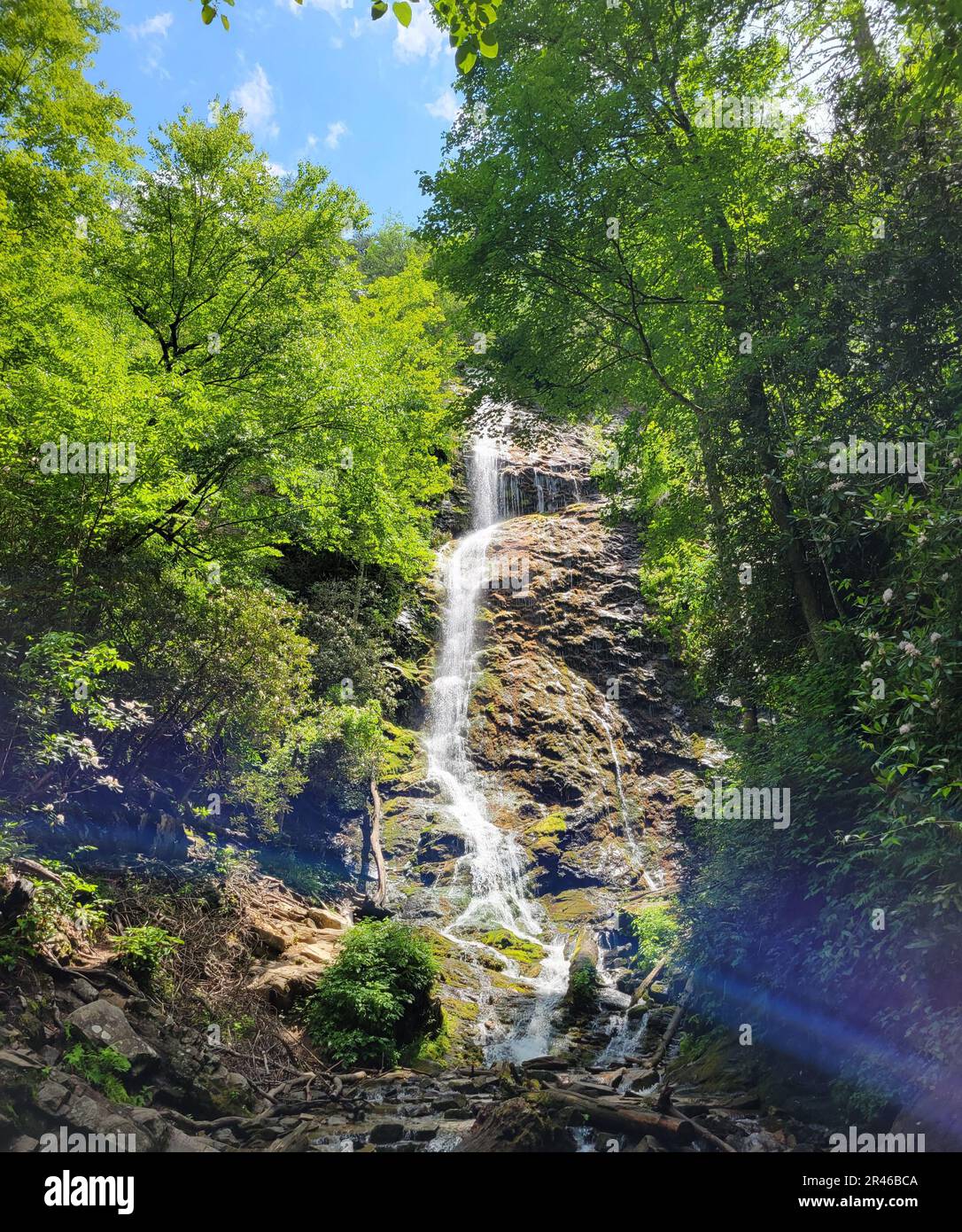 A stunning outdoor landscape featuring a waterfall cascading from a ...