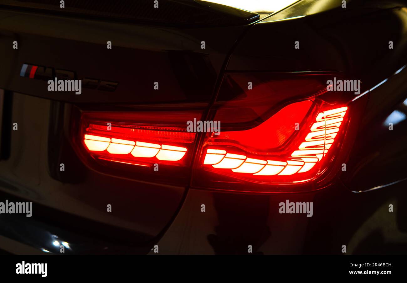 The back red light of an exotic metallic black BMW M3 CS m power sports ...