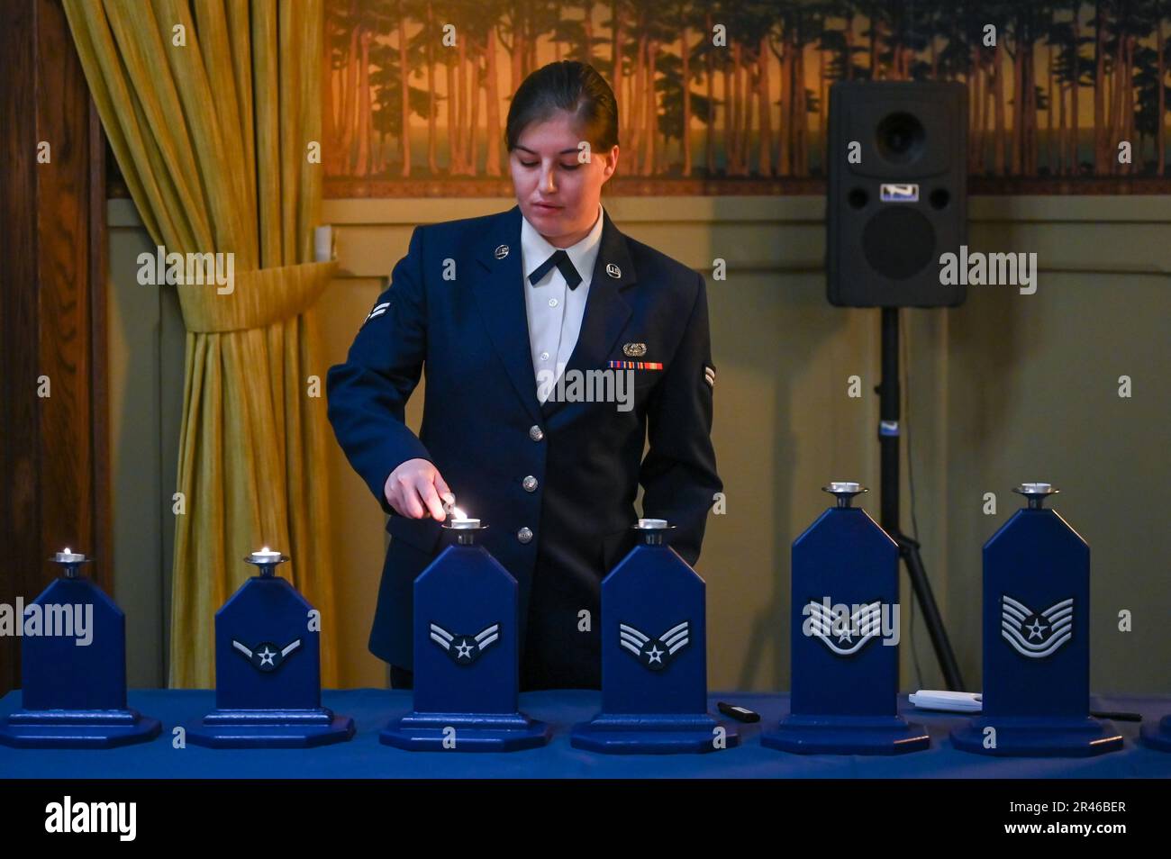 Airman 1st Class Kaeli Schiff, 75th Communications Squadron, lights the ...