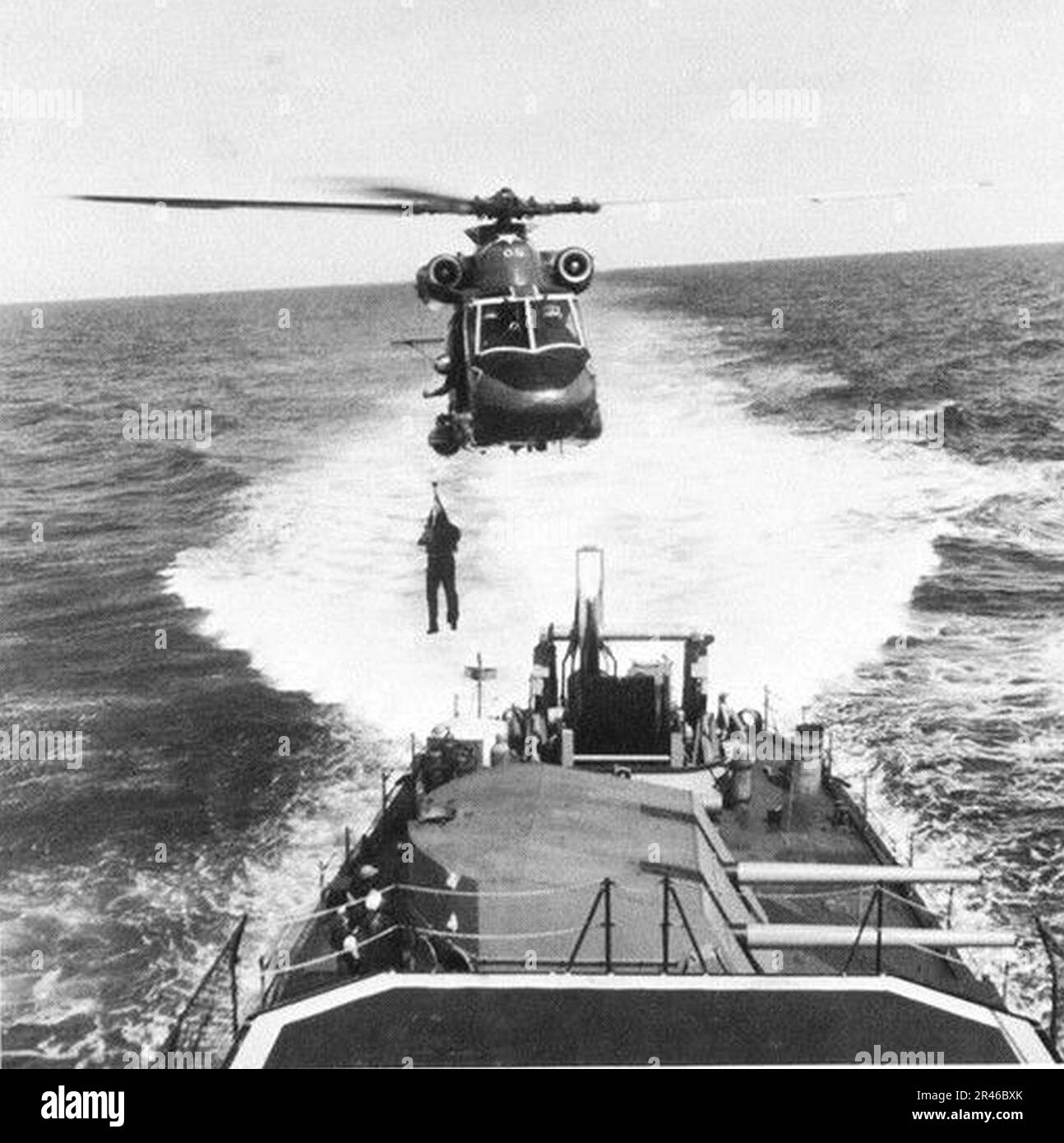 UH-2C Seasprite lifts sailor from USS Wallce L. Lind (DD-703), circa in ...