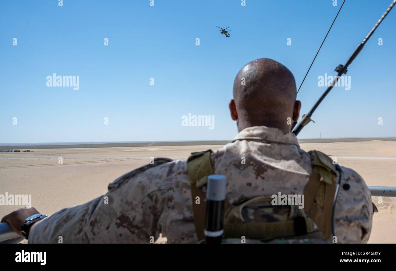 A U.S. Marine Task Force 51/5 Joint Tactical Air Controller, radios to ...