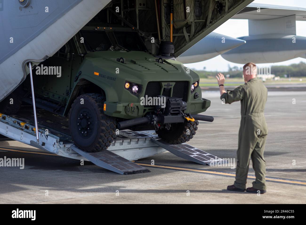 A U.S. Marine with Marine Aerial Refueler Transport Squadron 153 guides ...