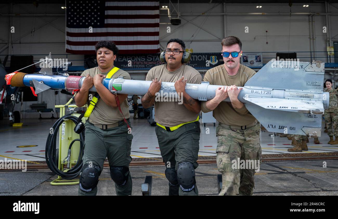 A 43rd Fighter Generation Squadron loadcrew carries an AIM-9 to their ...
