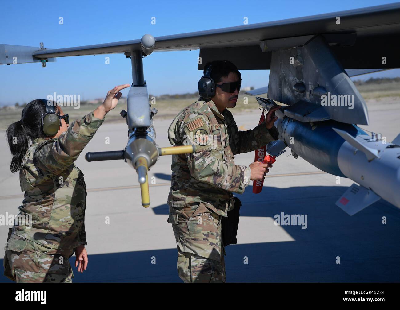 U.S. Air Force Tech Sgt. Audrey Alejandro, left, a weapons team chief ...