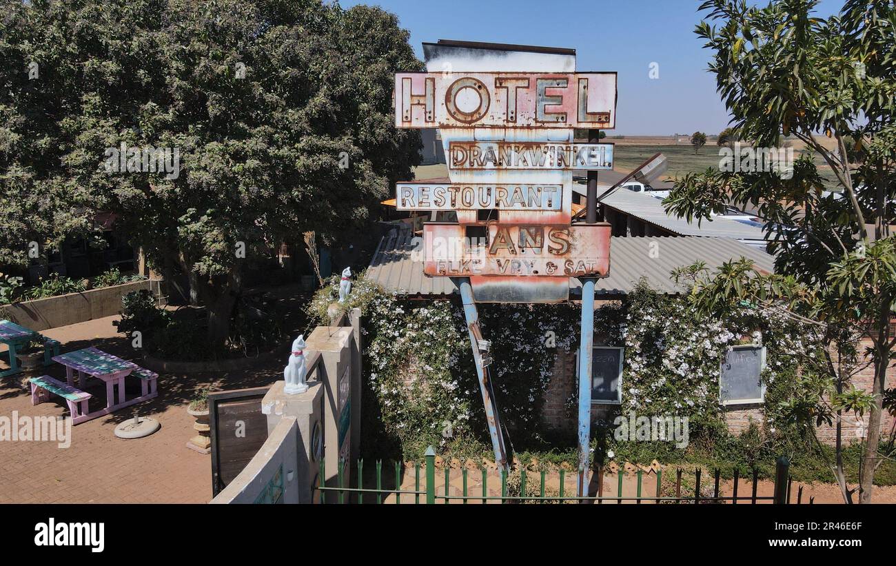 A faded vintage hotel sign, with a worn-out and weathered appearance ...