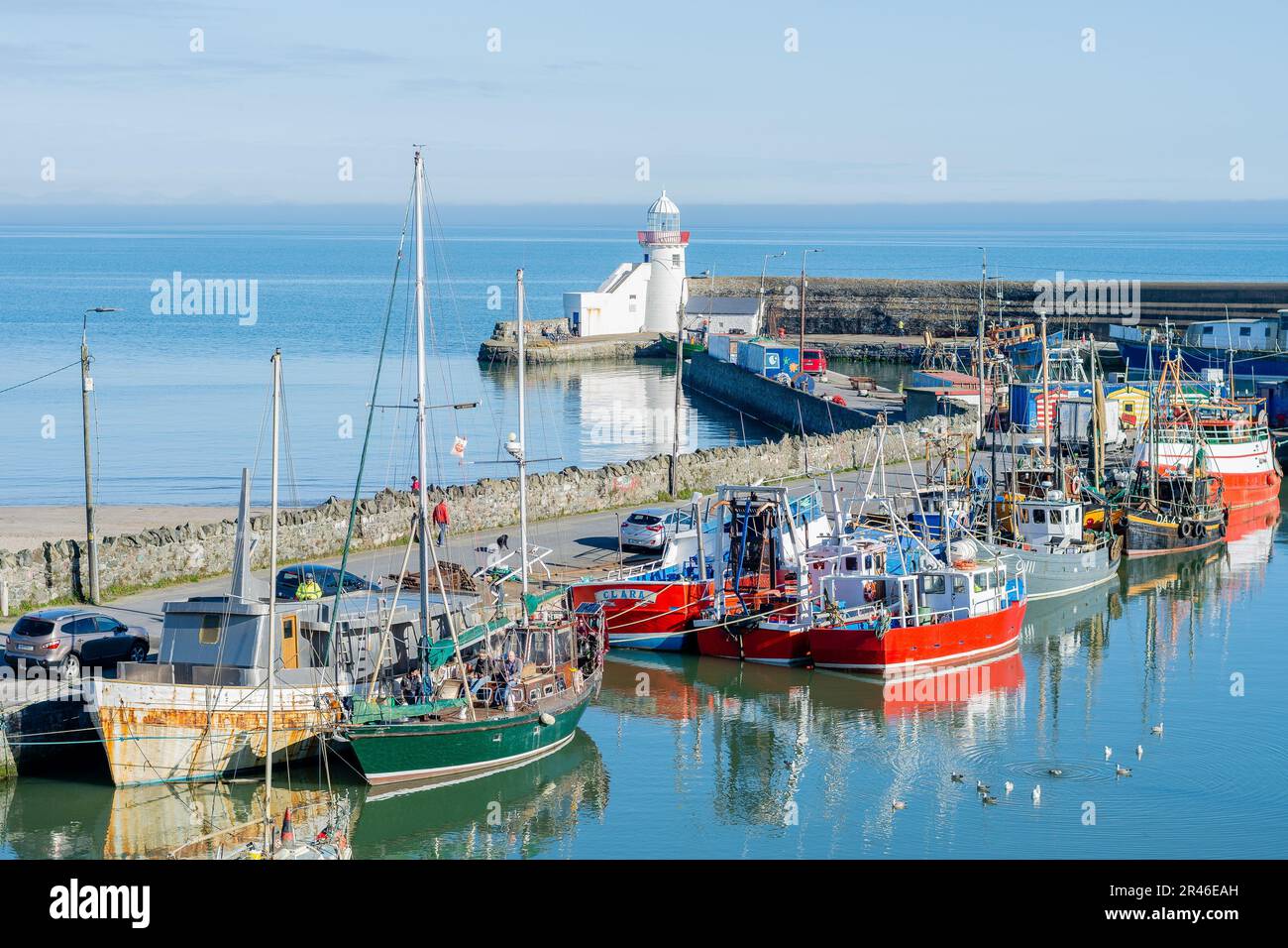 An aerial view of Balbriggan harbor and lighthouse in early morning ...