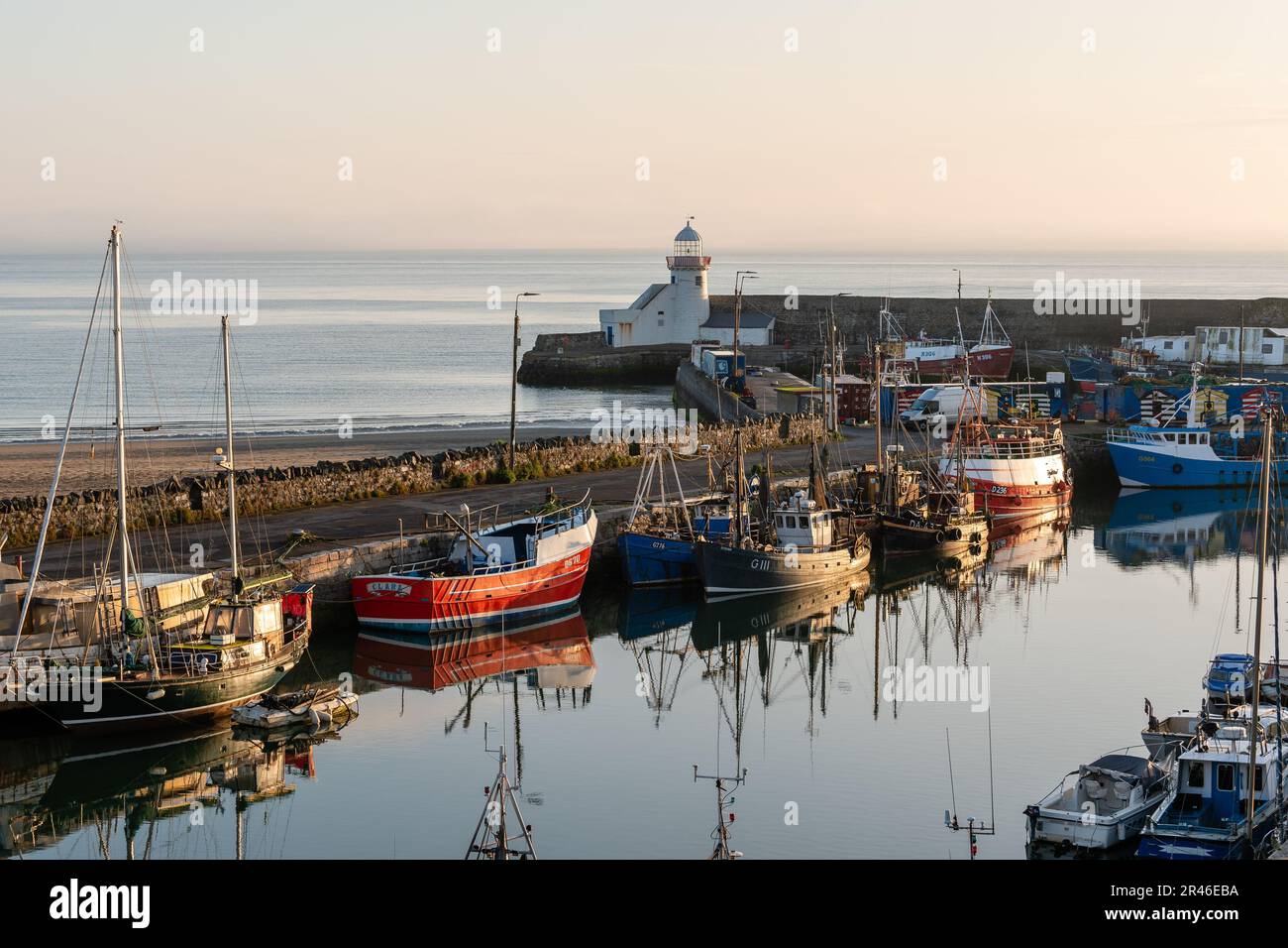 An aerial view of Balbriggan harbor and lighthouse in early morning ...