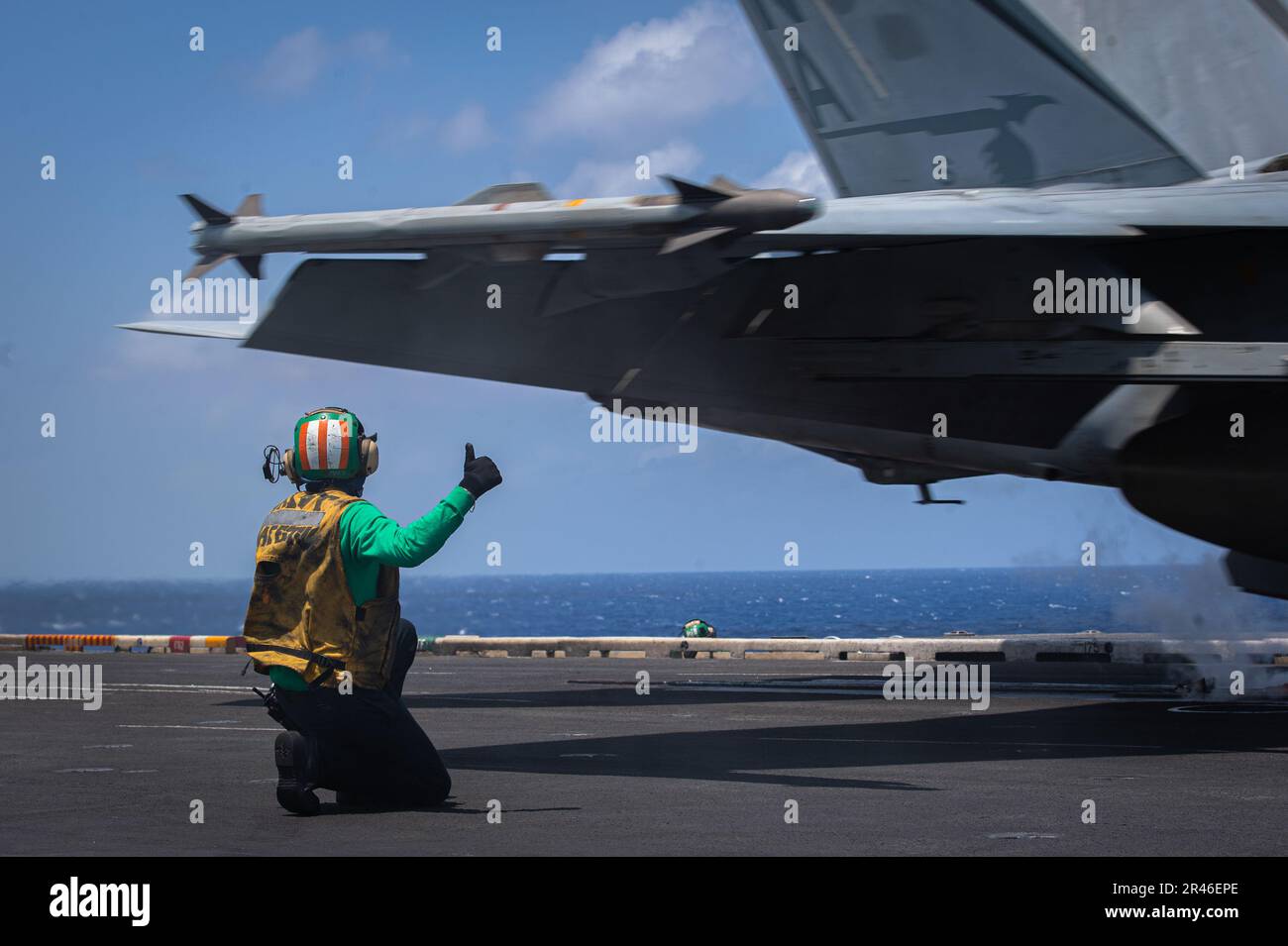 230410-N-MH015-1110 PHILIPPINE SEA (April 10, 2023) A U.S. Navy Sailor launches an F/A-18F Super ...