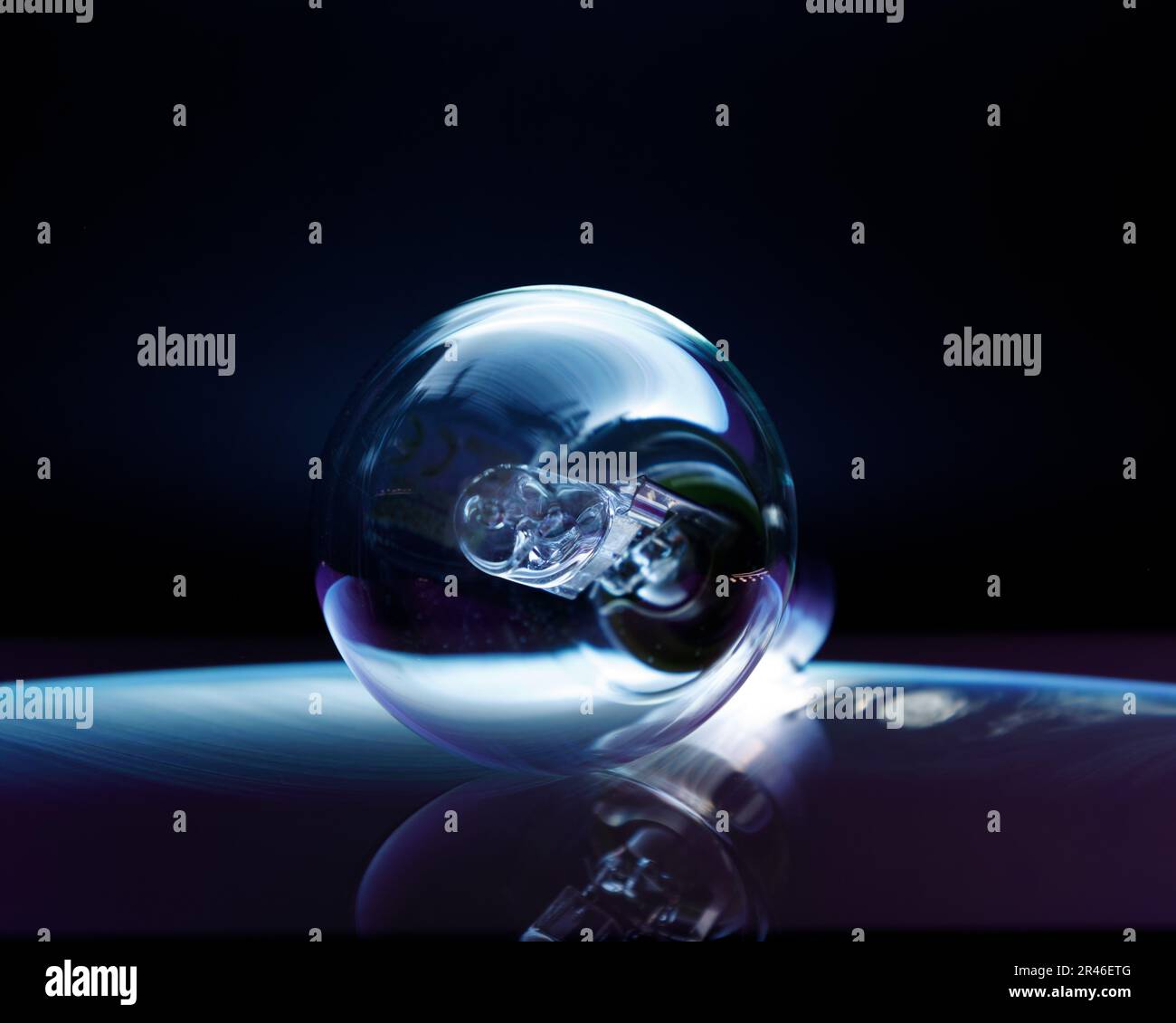 An intriguing white light emanating from a light bulb in a dimly lit ...