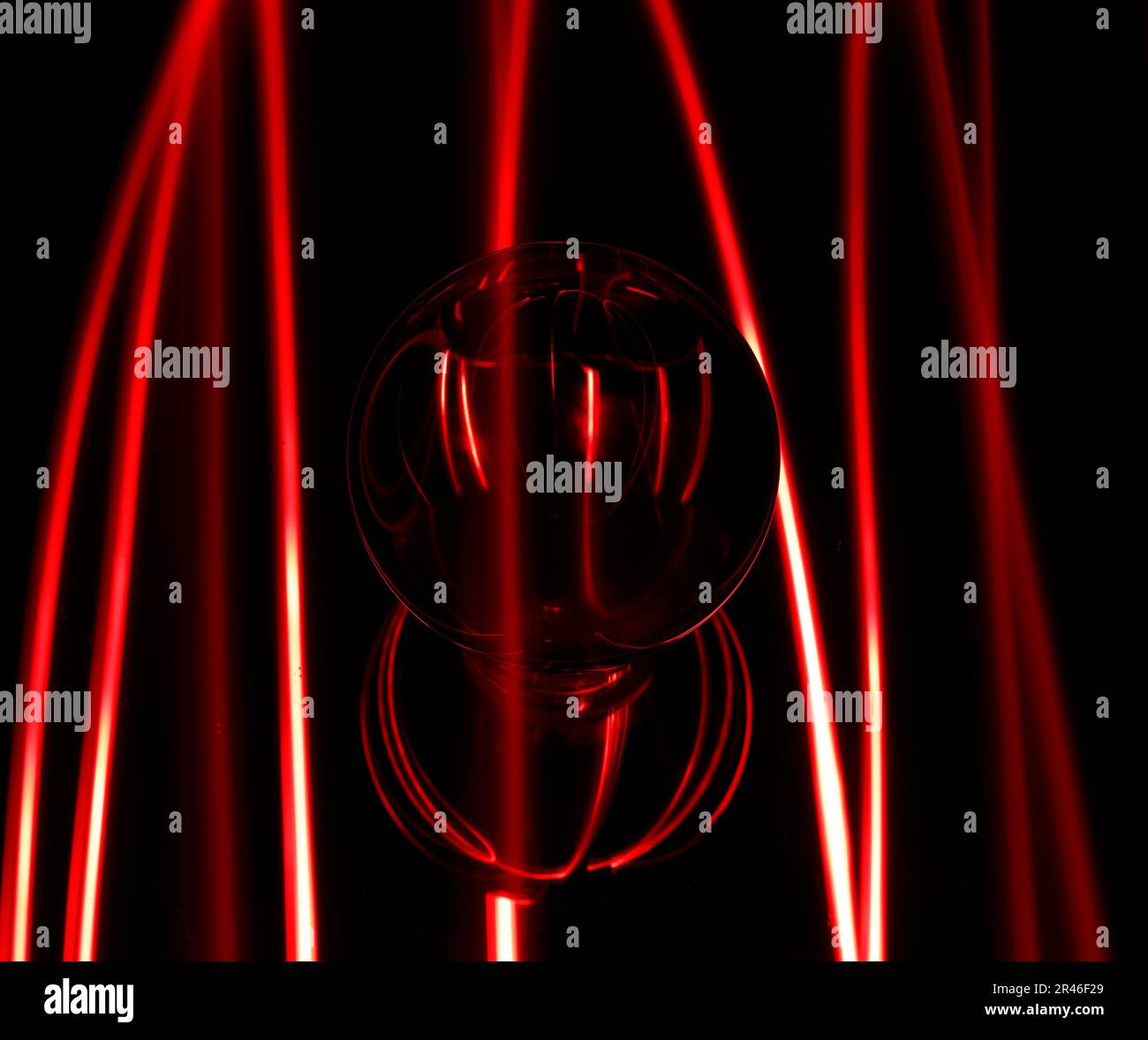 An intriguing red light emanating from a light bulb in a dimly lit ...