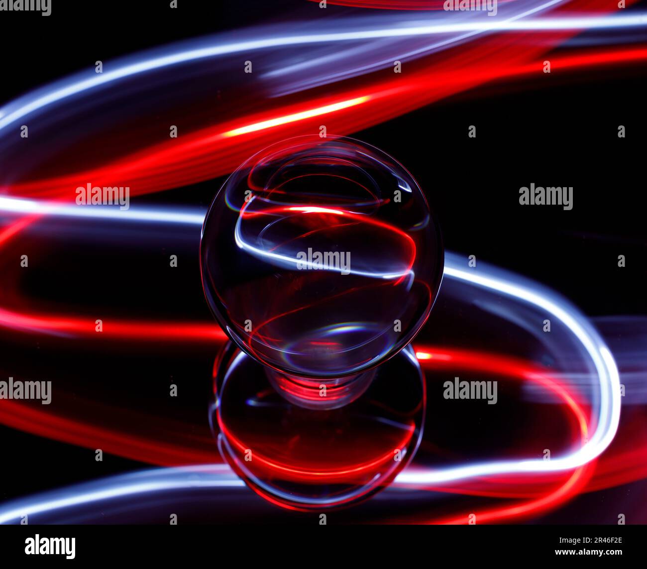 An intriguing red light emanating from a light bulb in a dimly lit ...