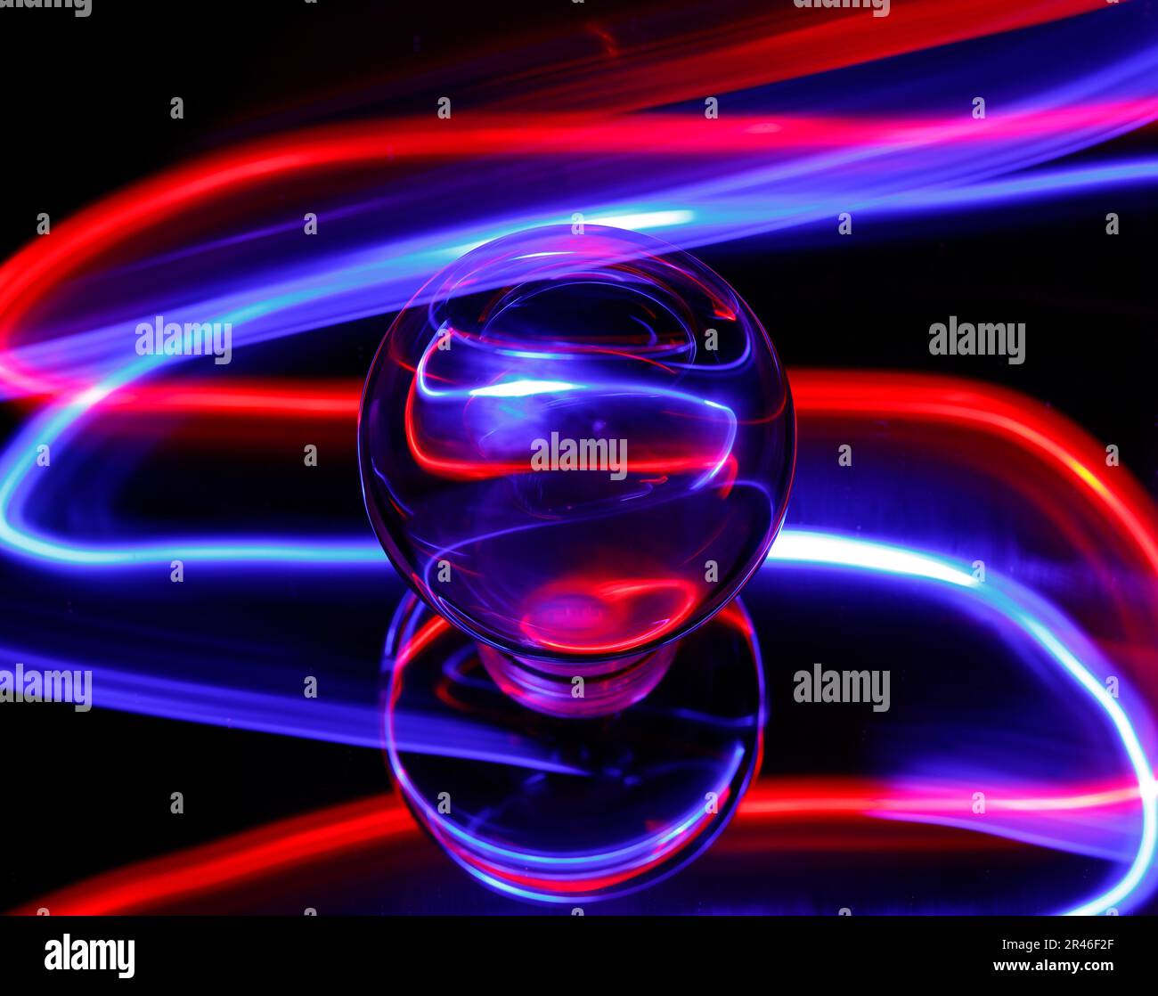 An intriguing red and purple light emanating from a light bulb in a ...