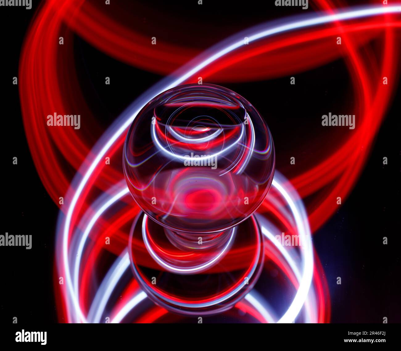 An intriguing red light emanating from a light bulb in a dimly lit ...