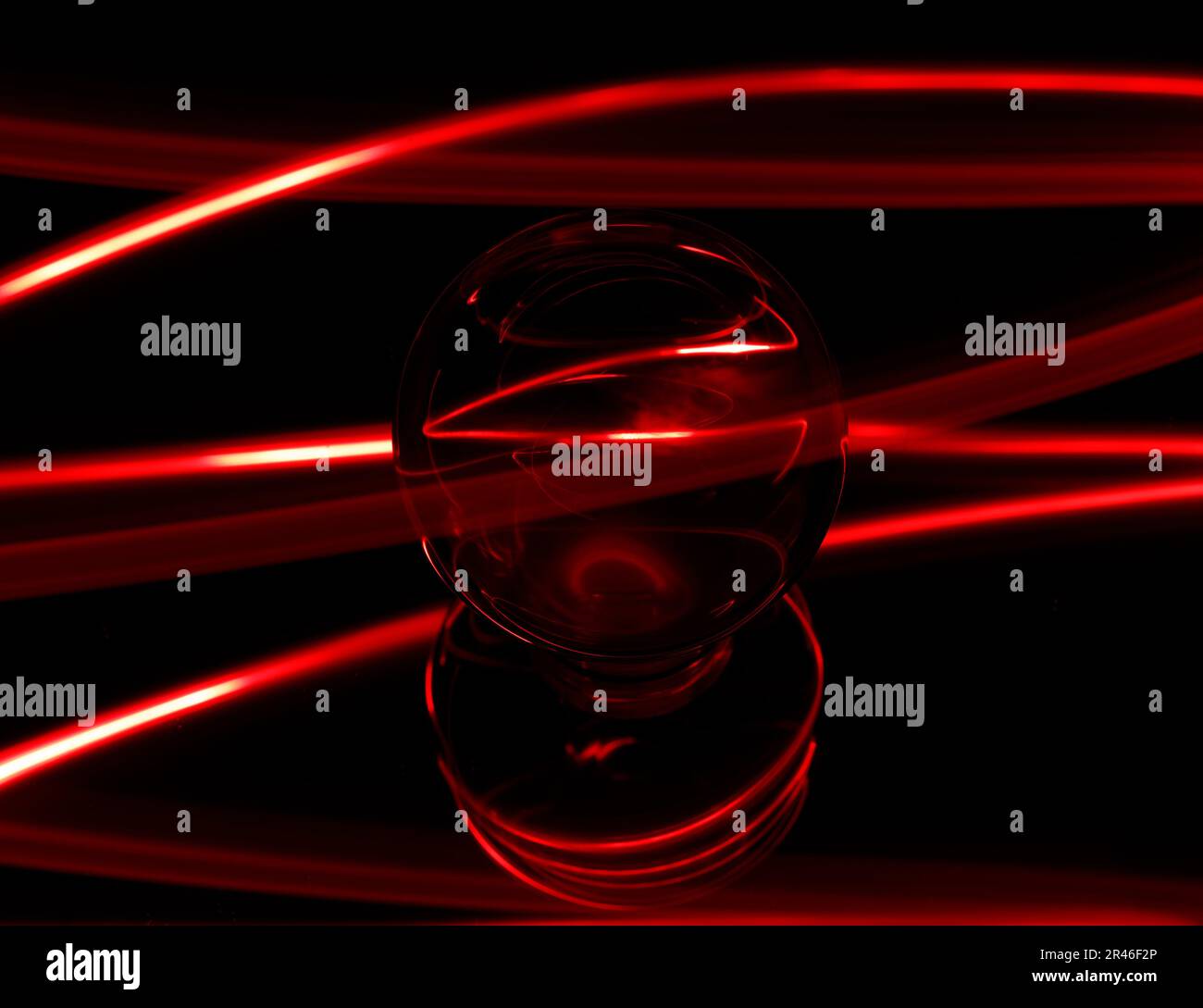 An intriguing red light emanating from a light bulb in a dimly lit ...