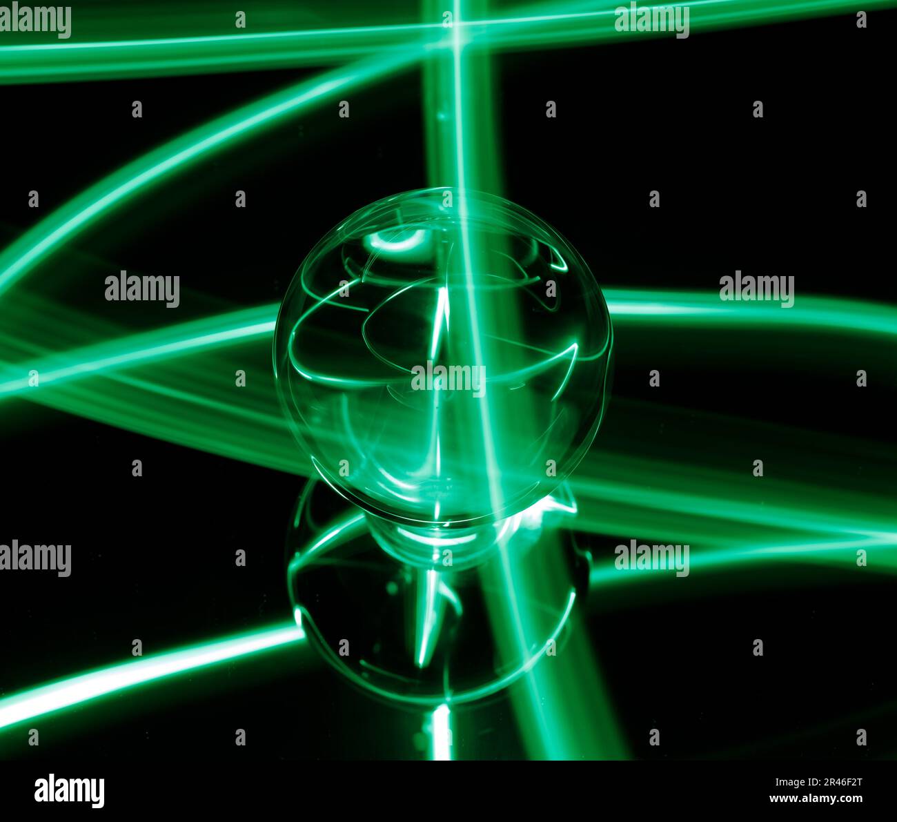 An intriguing green light emanating from a light bulb in a dimly lit ...