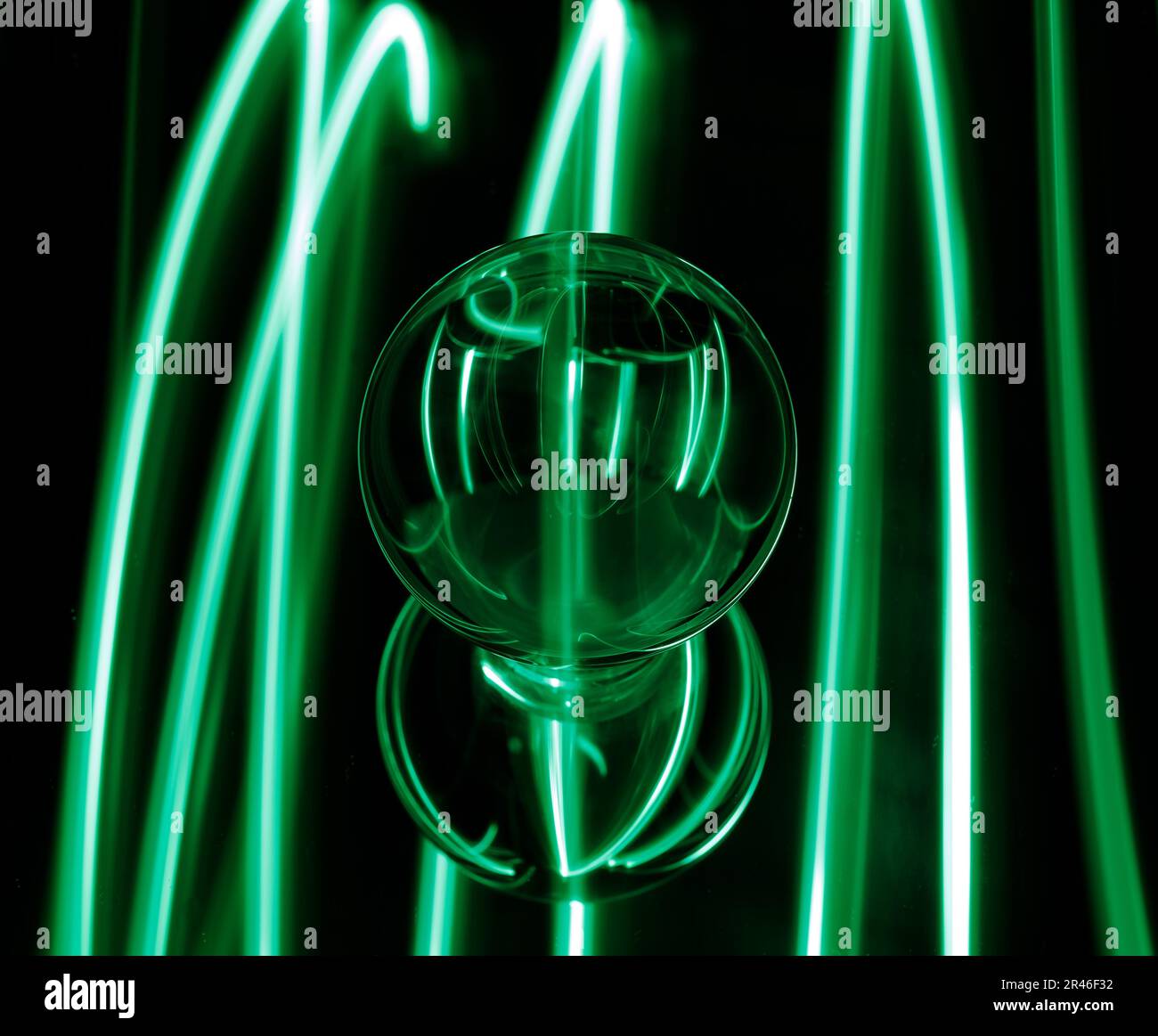 An intriguing green light emanating from a light bulb in a dimly lit ...