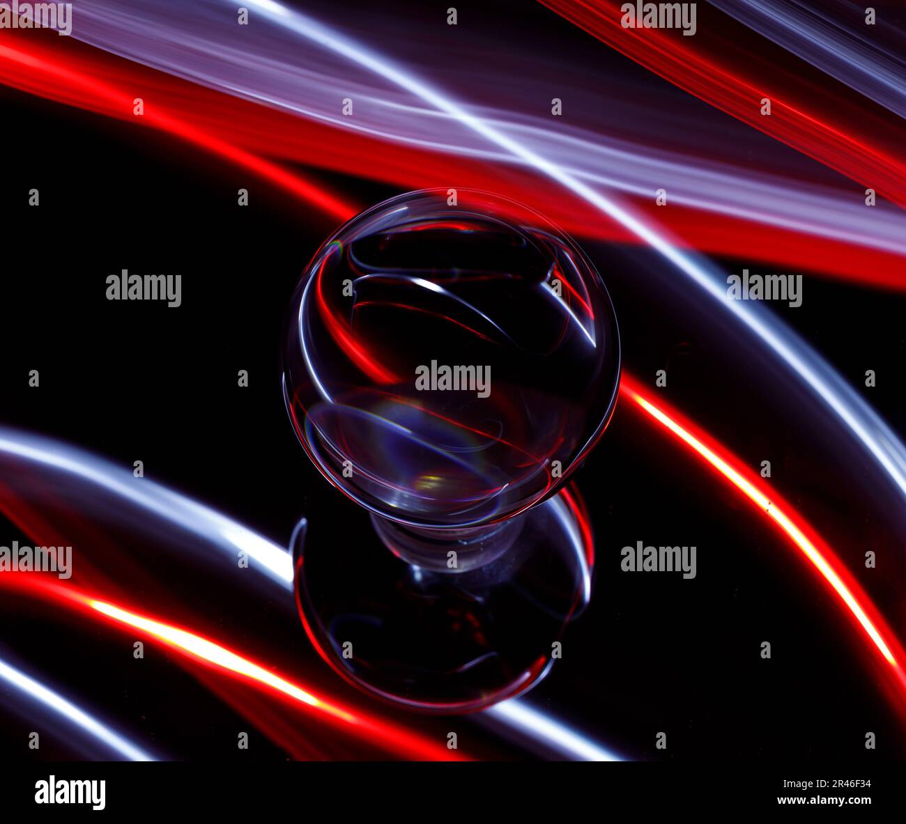 An intriguing red light emanating from a light bulb in a dimly lit ...