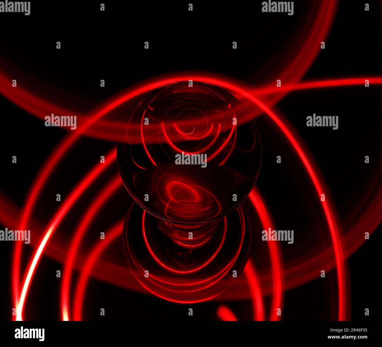 An intriguing red light emanating from a light bulb in a dimly lit ...