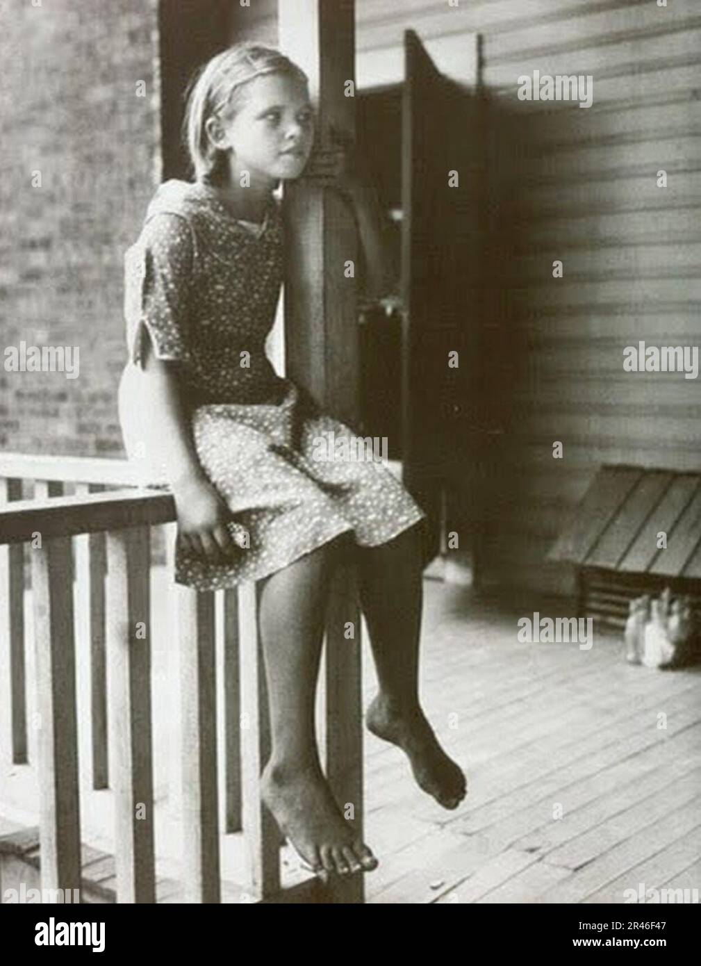 Ulmann, Girl on an fence Stock Photo - Alamy