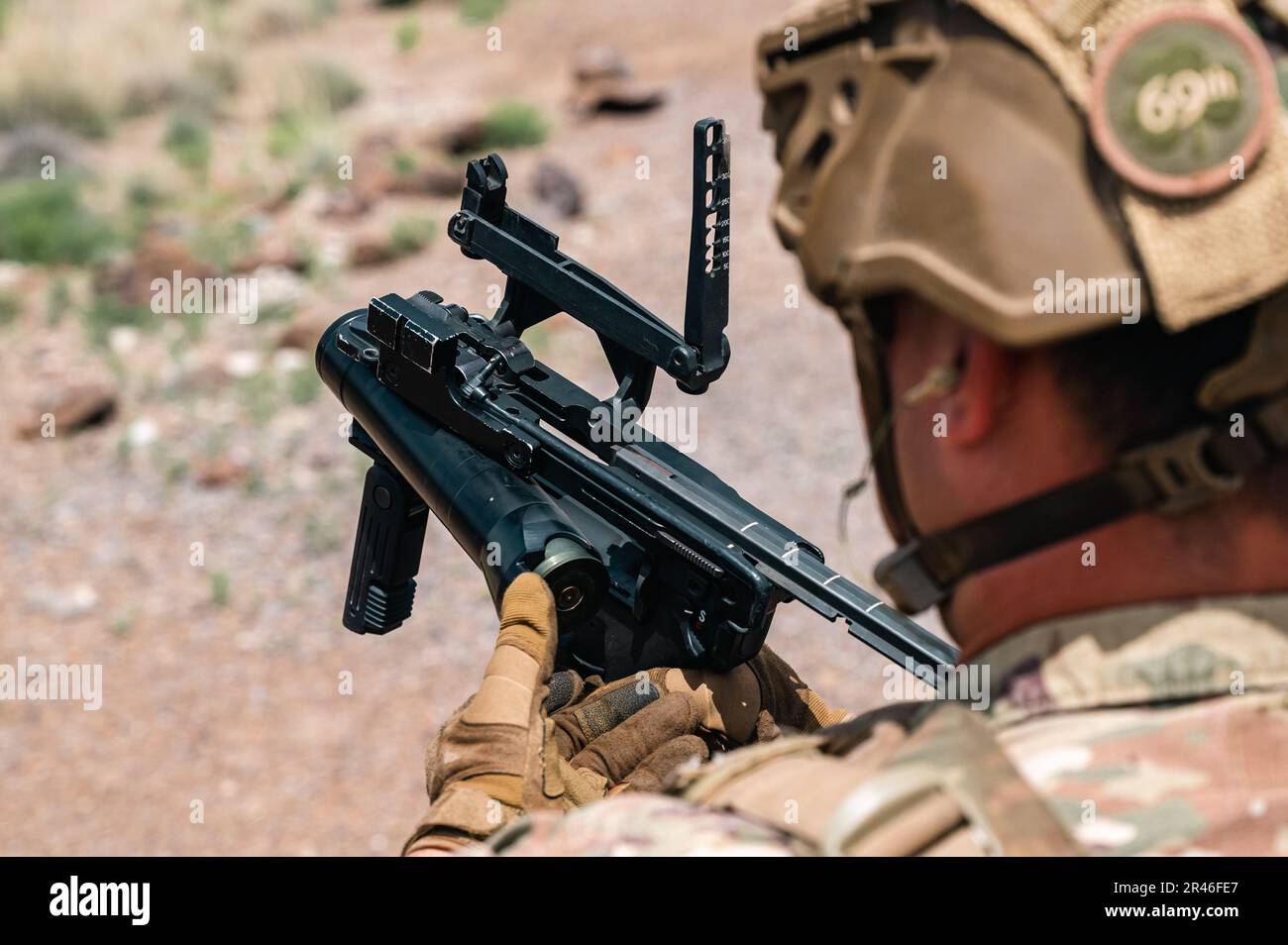 A U.S. Army soldier assigned to Task Force Wolfhound, reloads an M320 ...