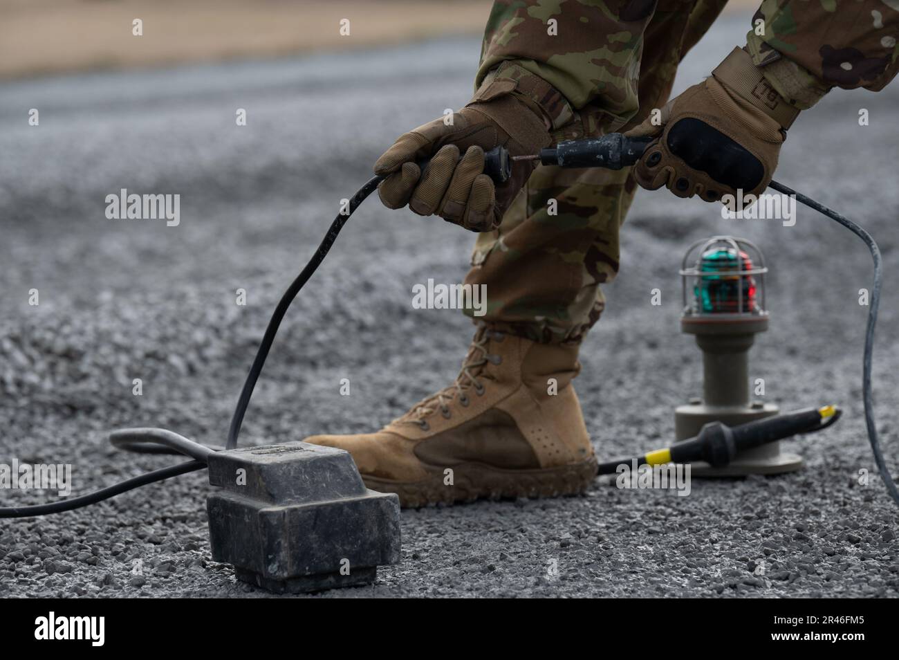 A civil engineer from 11th Civil Engineer Squadron connects lights for ...