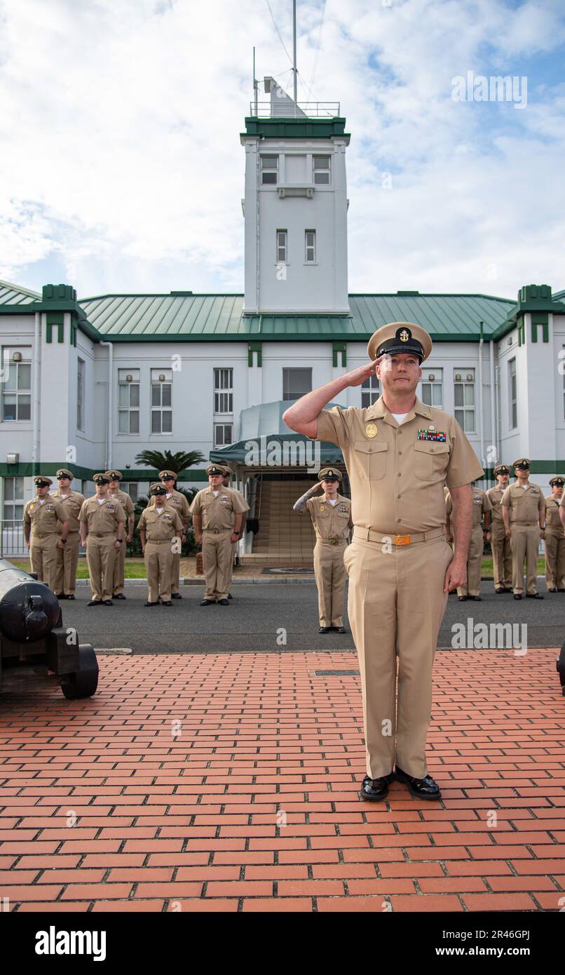 Chief Master-at-Arms Joseph Hammond salutes during morning colors at ...