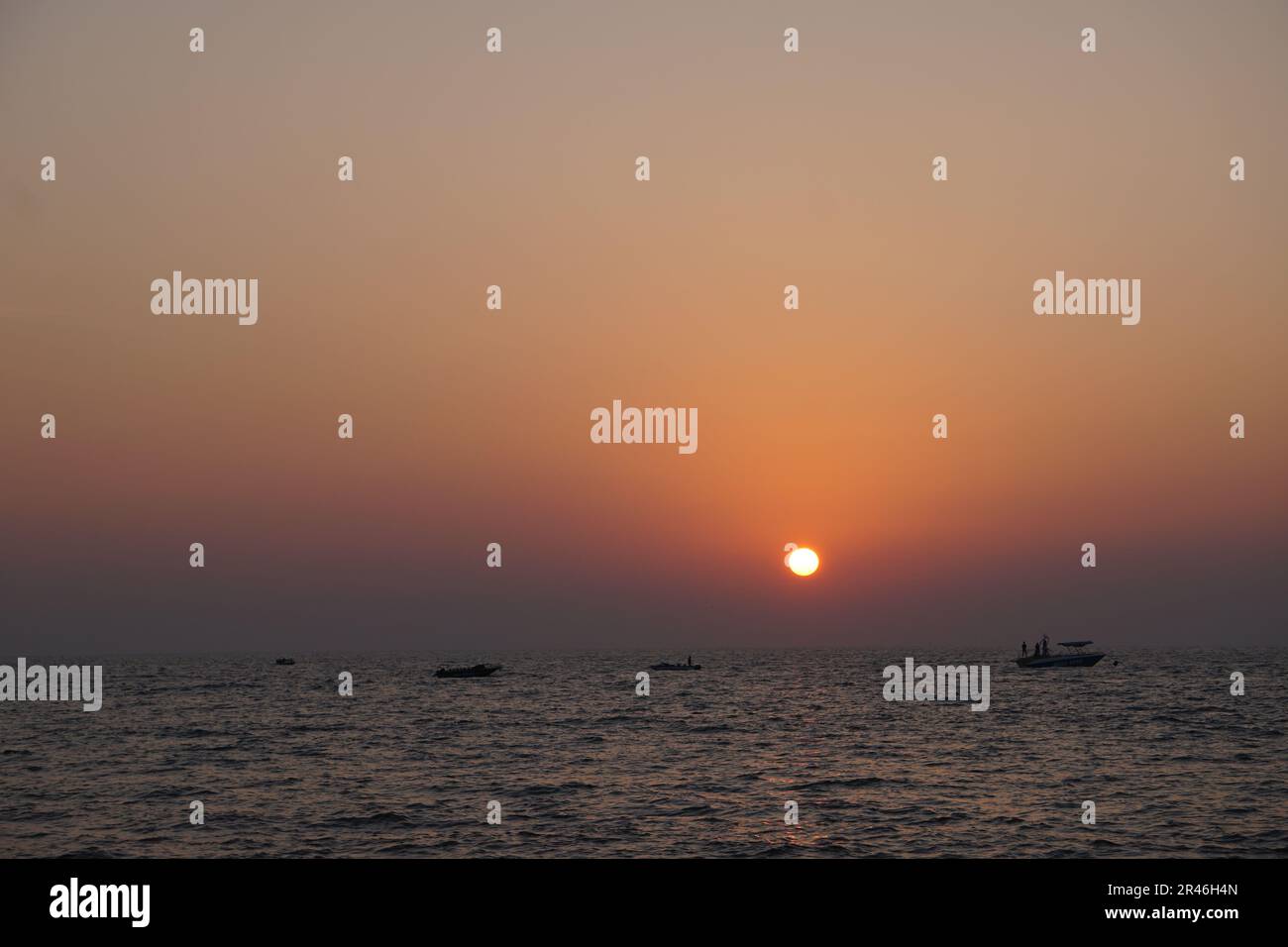 A stunning aerial view of a sun setting over the horizon of the vast ...