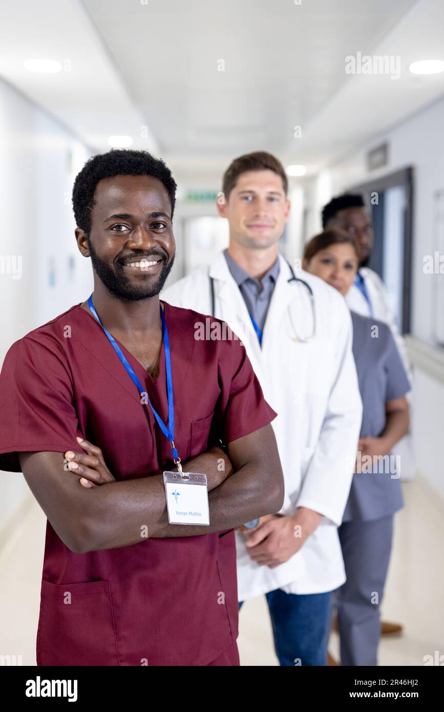 Unaltered portrait of smiling african american male doctor and diverse ...