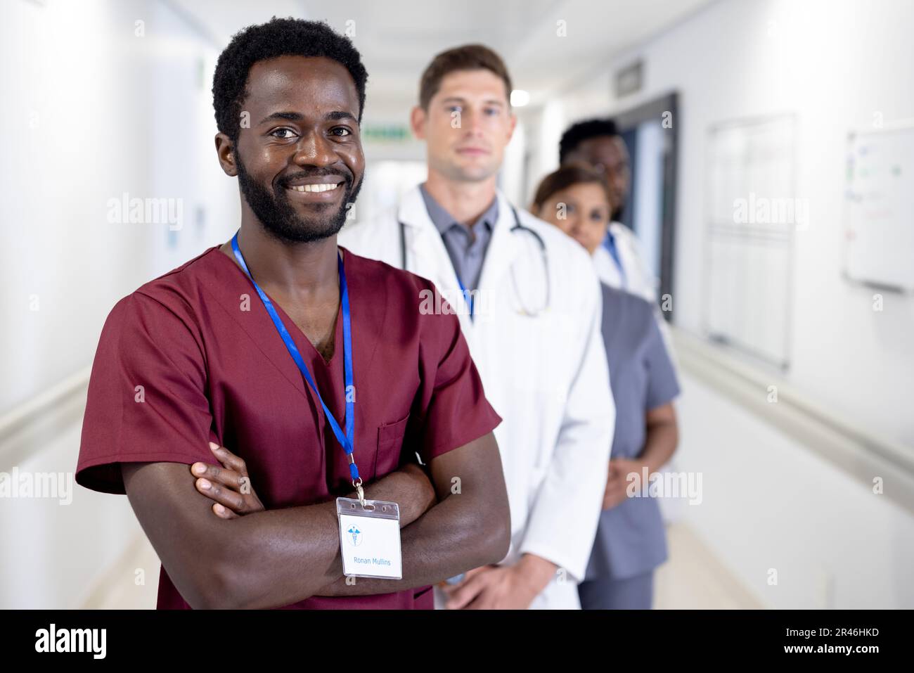 Unaltered portrait of smiling african american male doctor and diverse ...