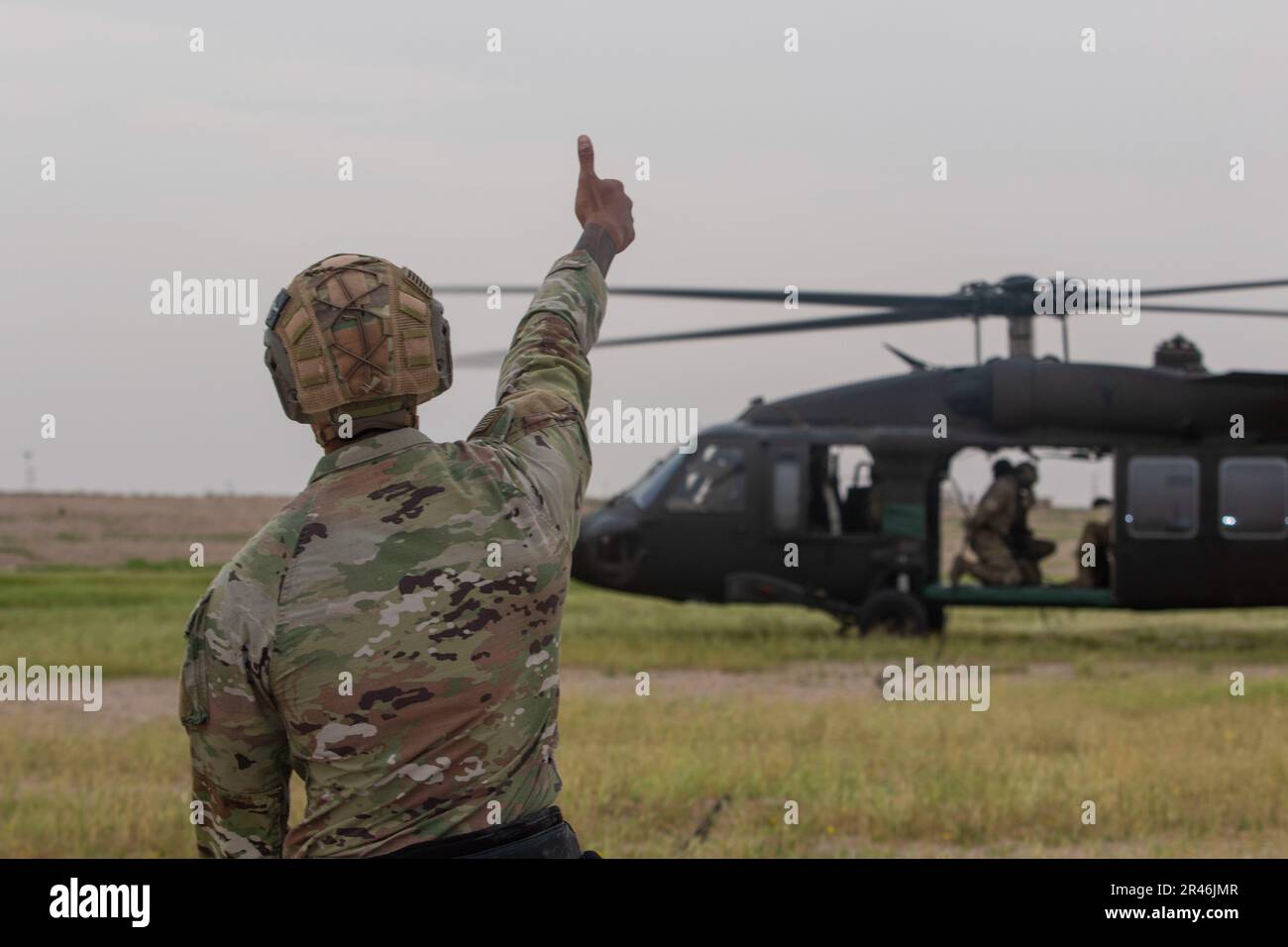 A Rappel Master Course instructor signals to the flight crew during the ...
