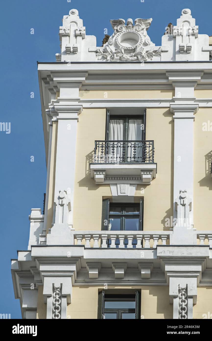 Cornice an old building with artistic metal forging on the balconies ...