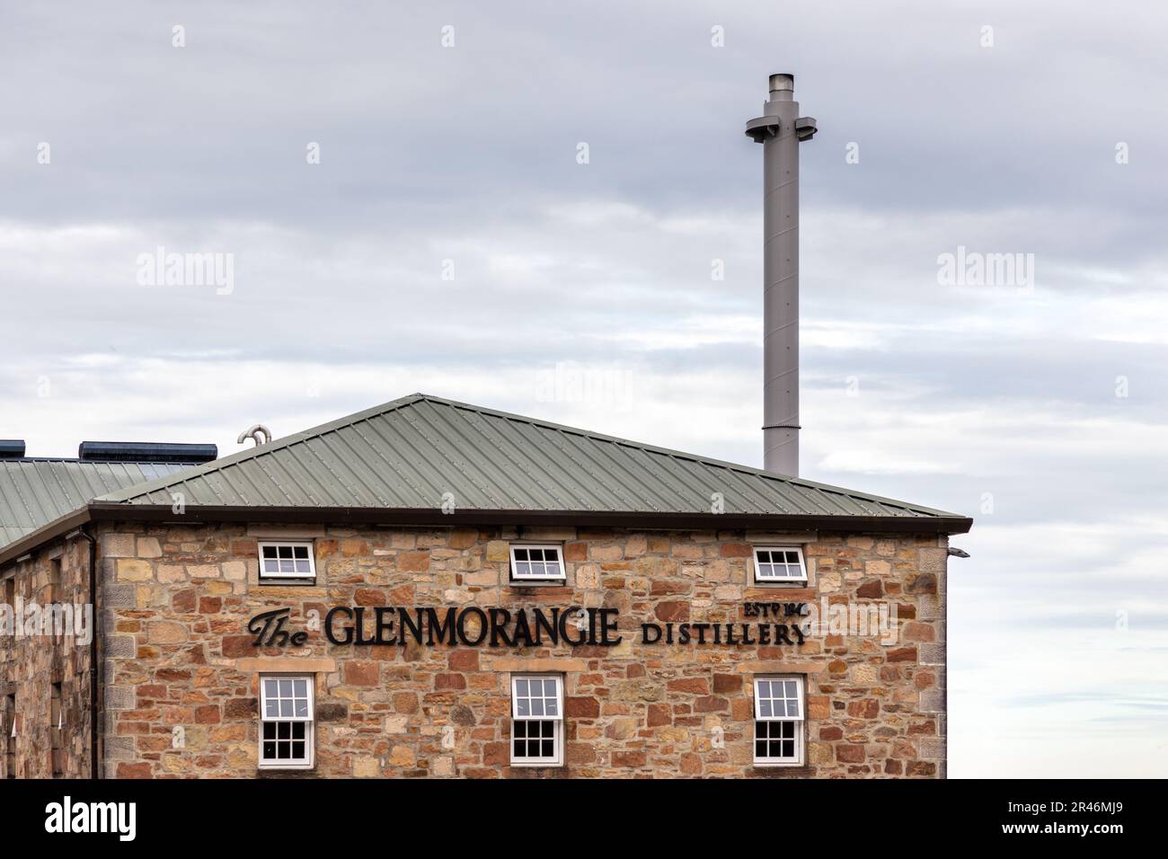 An impressive brick building of Glenmorangie Distillery with an iron ...