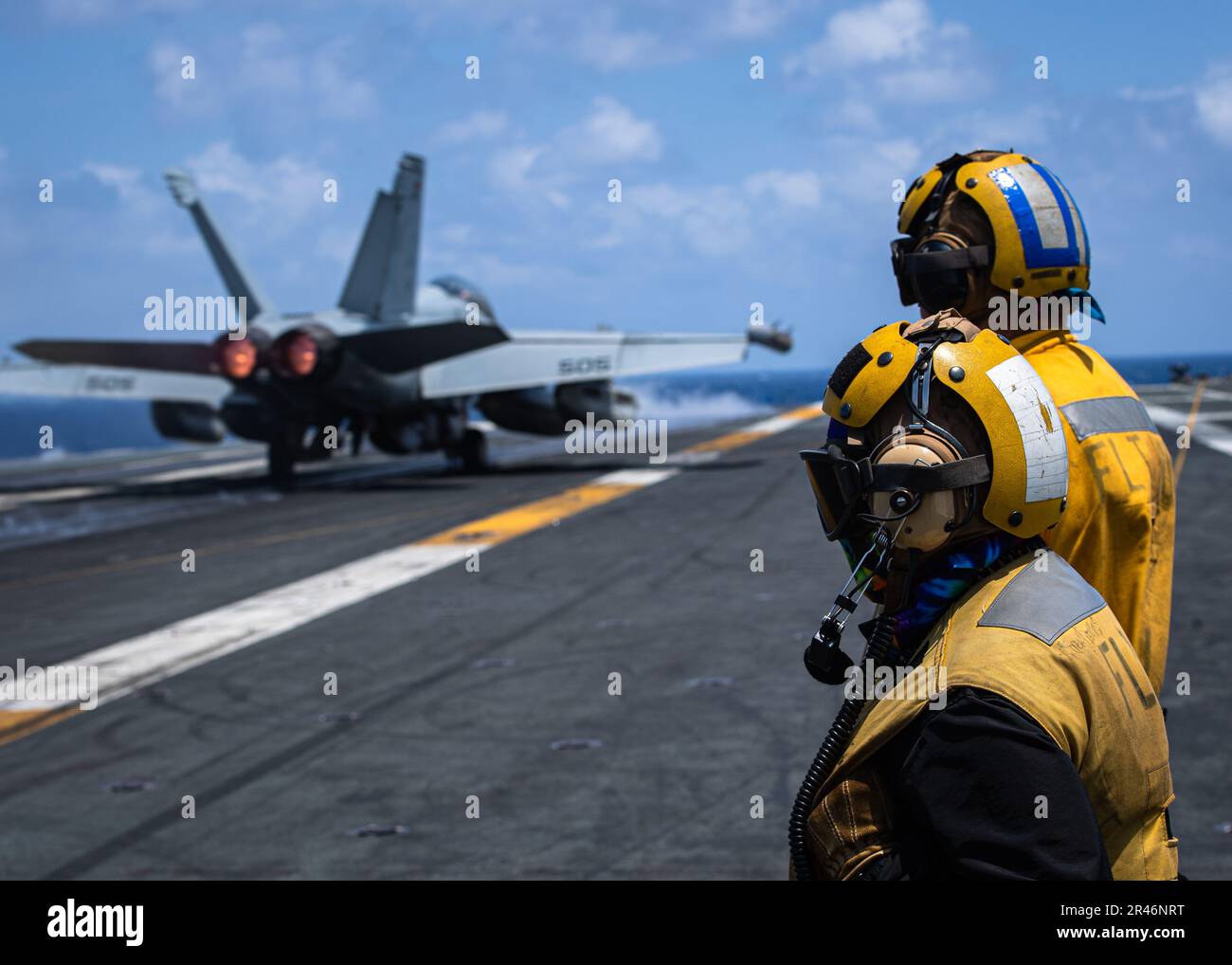 230410-N-MH015-1098 PHILIPPINE SEA (April 10, 2023) U.S. Navy Sailors observe an E/A-18G Growler ...