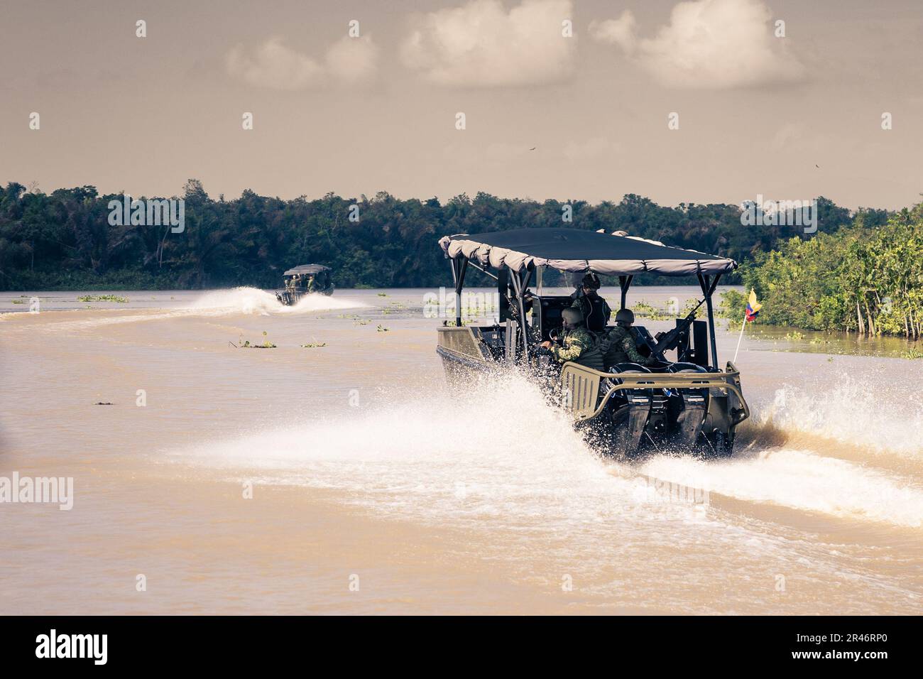 Two Colombian Marine Corps combat riverine boats sail on the Atrato ...