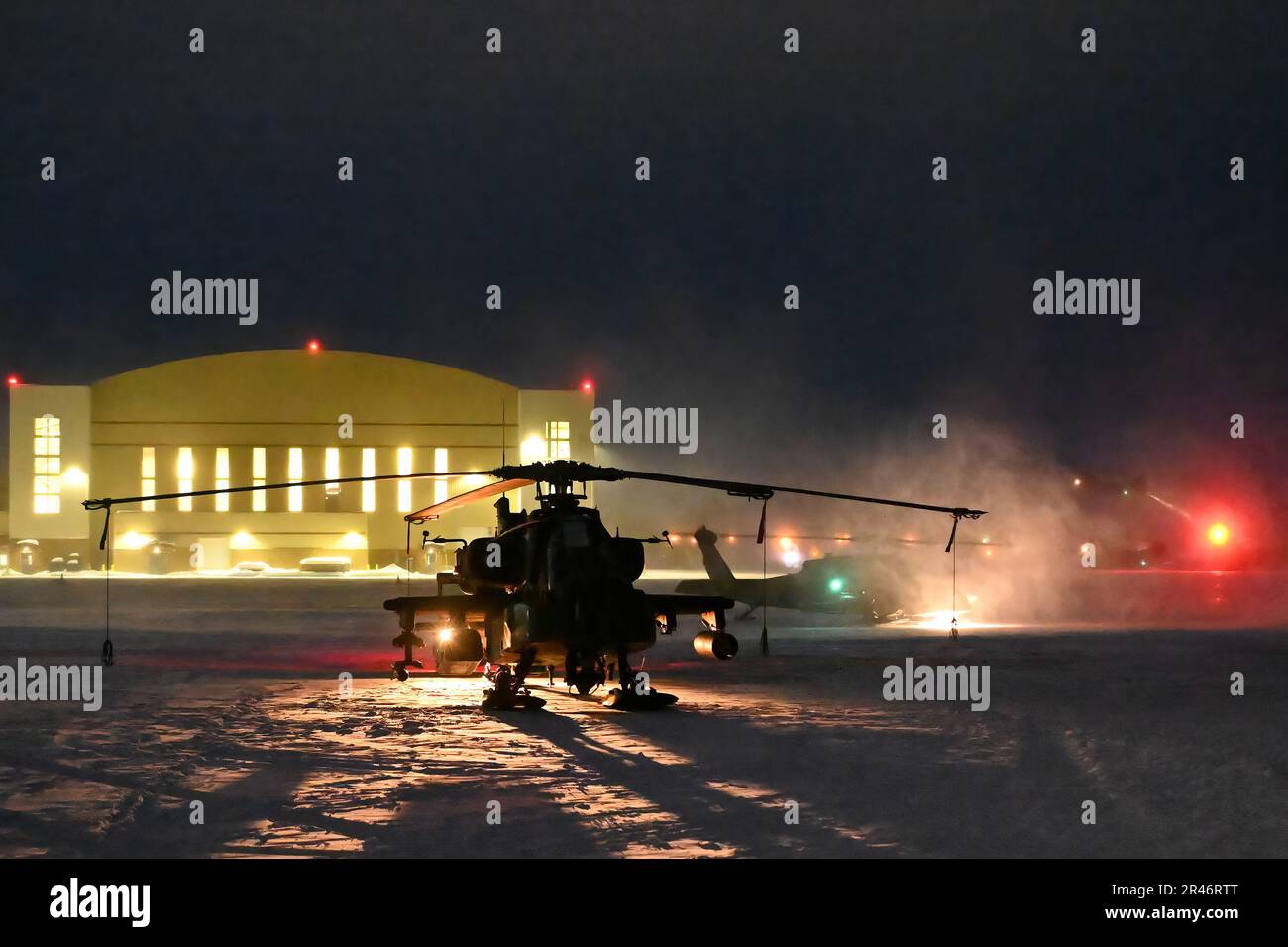 Aviation crews prepare to move an AH-64 Apache helicopter from the 1st ...