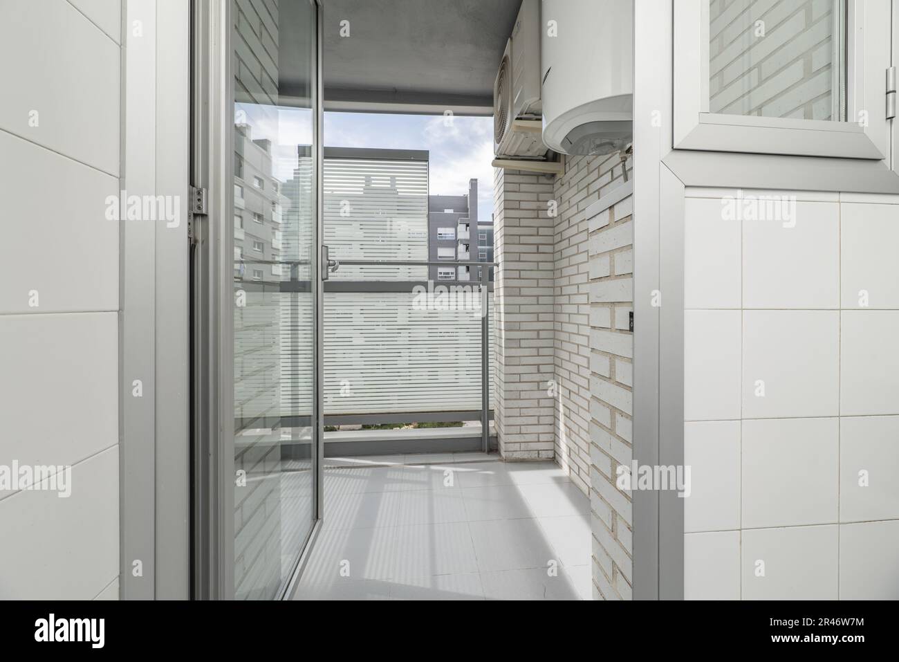 A small closed terrace to use as a laundry room Stock Photo - Alamy