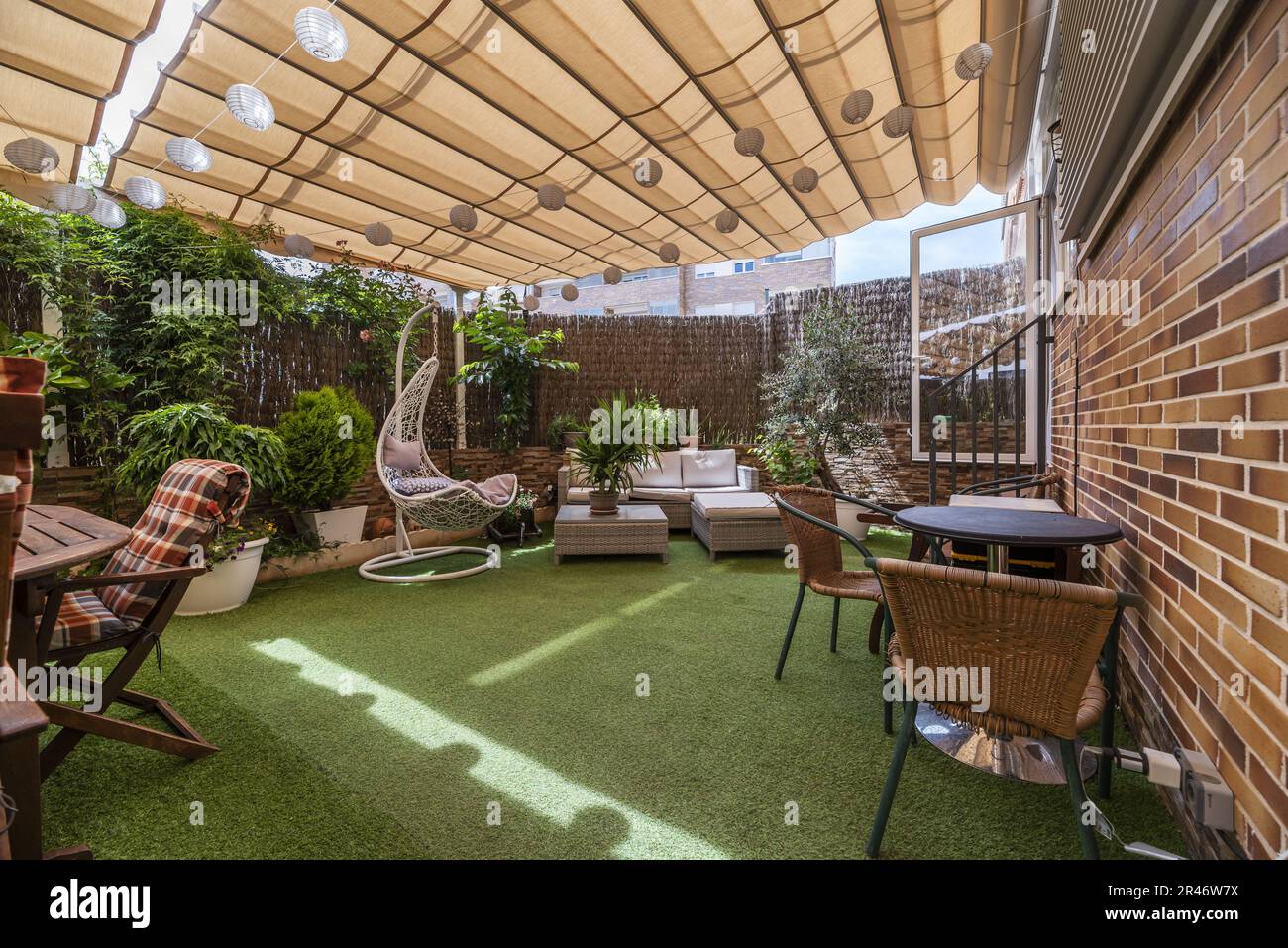 Terrace of a house with artificial grass floors, tables, outdoor ...