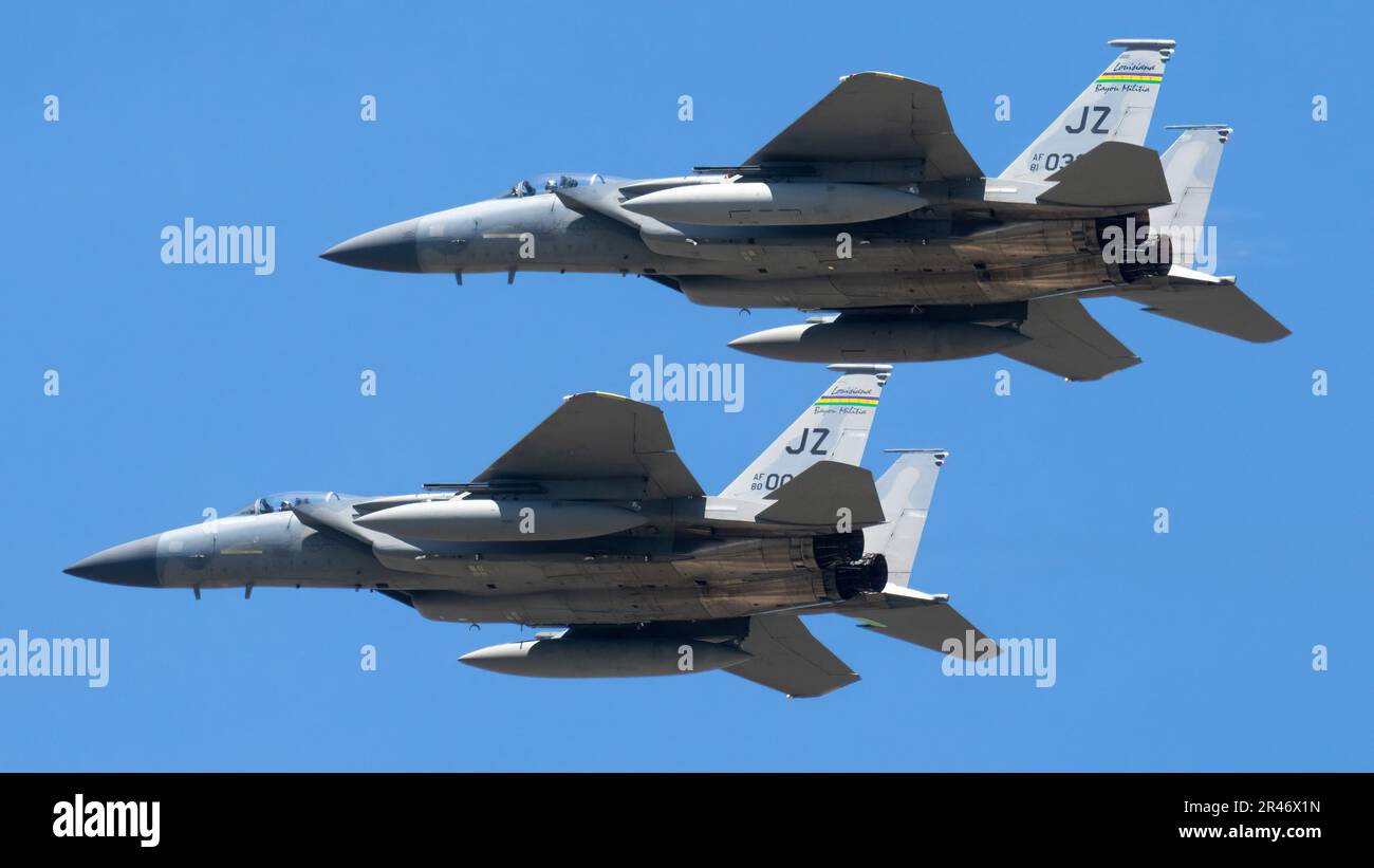 The two military fighter jets soaring through a clear, blue sky Stock ...