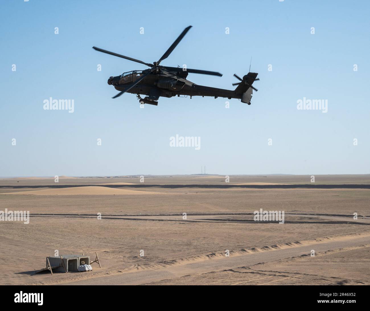 A U.S. Army Apache flies low over the target range during training at ...