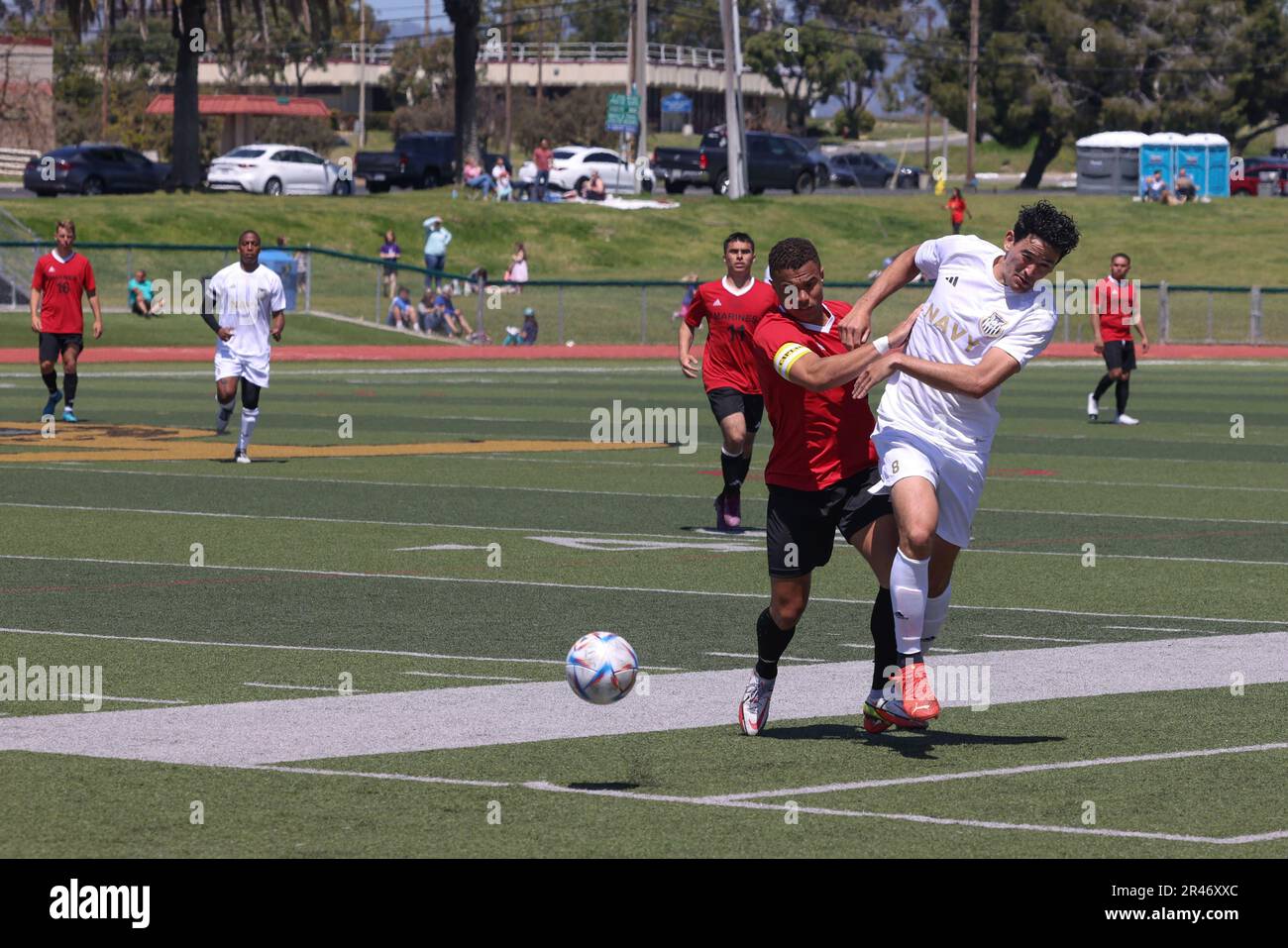 A U.S. Marine with the Marine Corps soccer team defends the ball during ...