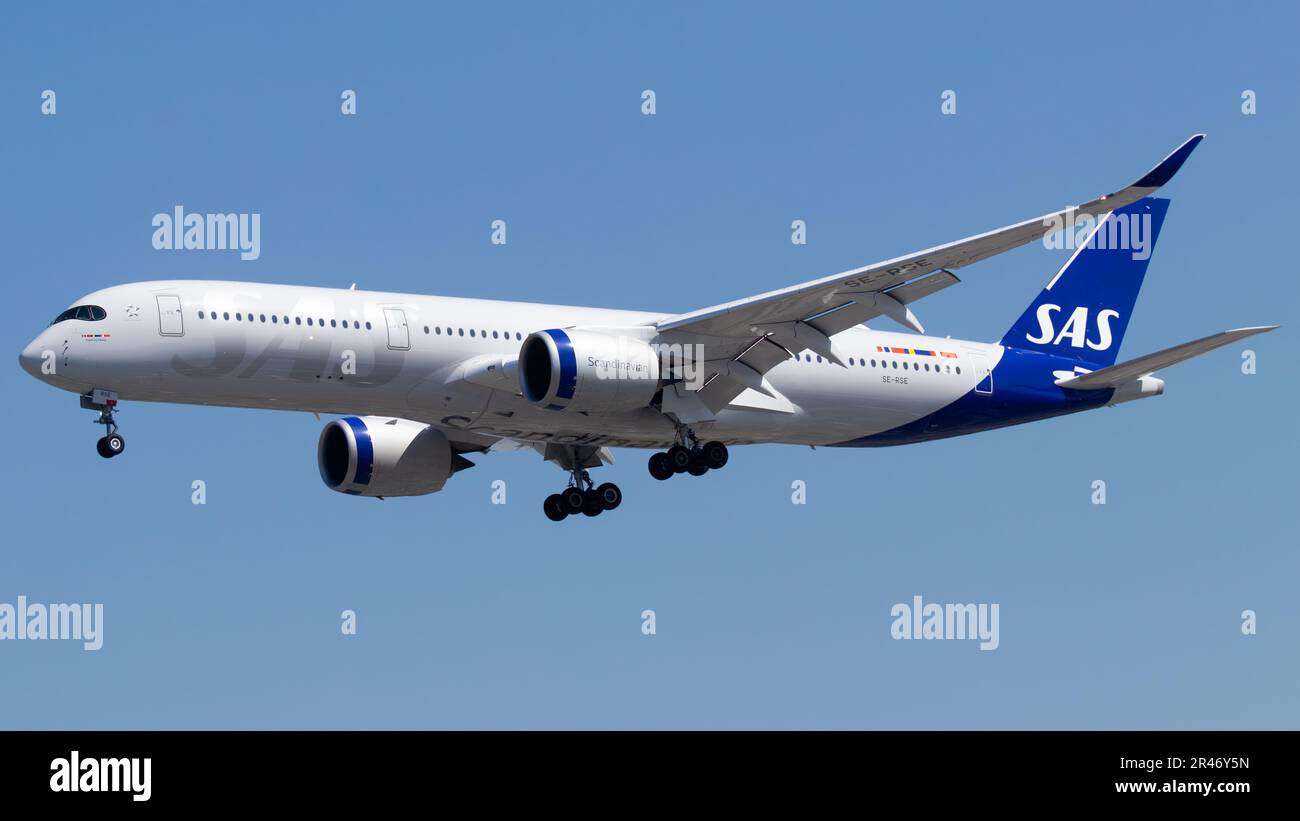 A Sas Airlines aircraft soaring against a blue sky backdrop Stock Photo ...