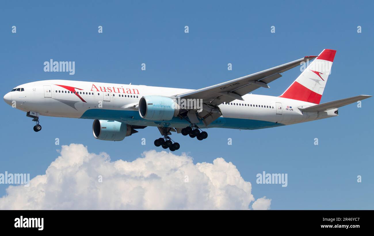 An Austrian Airlines aircraft soaring against a blue sky backdrop Stock ...