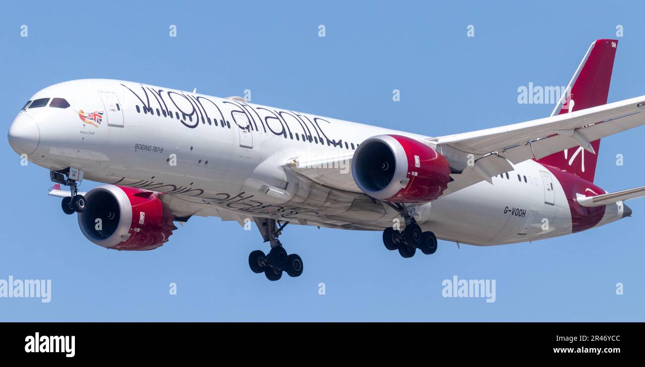 A Virgin Atlantic Airlines aircraft soaring against a blue sky backdrop ...