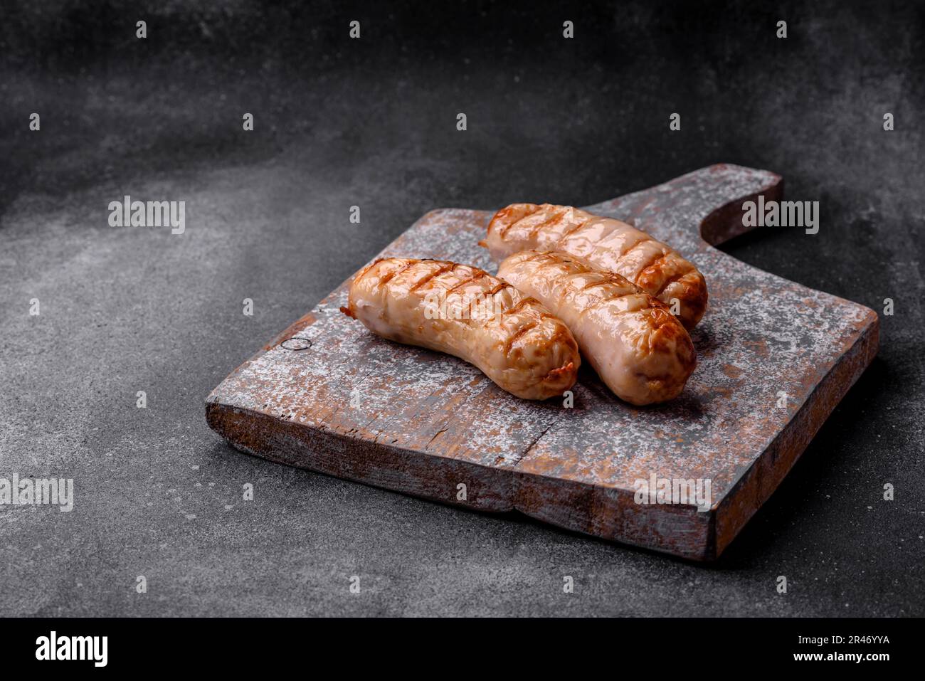Delicious grilled sausages from chicken or pork meat with salt, spices ...