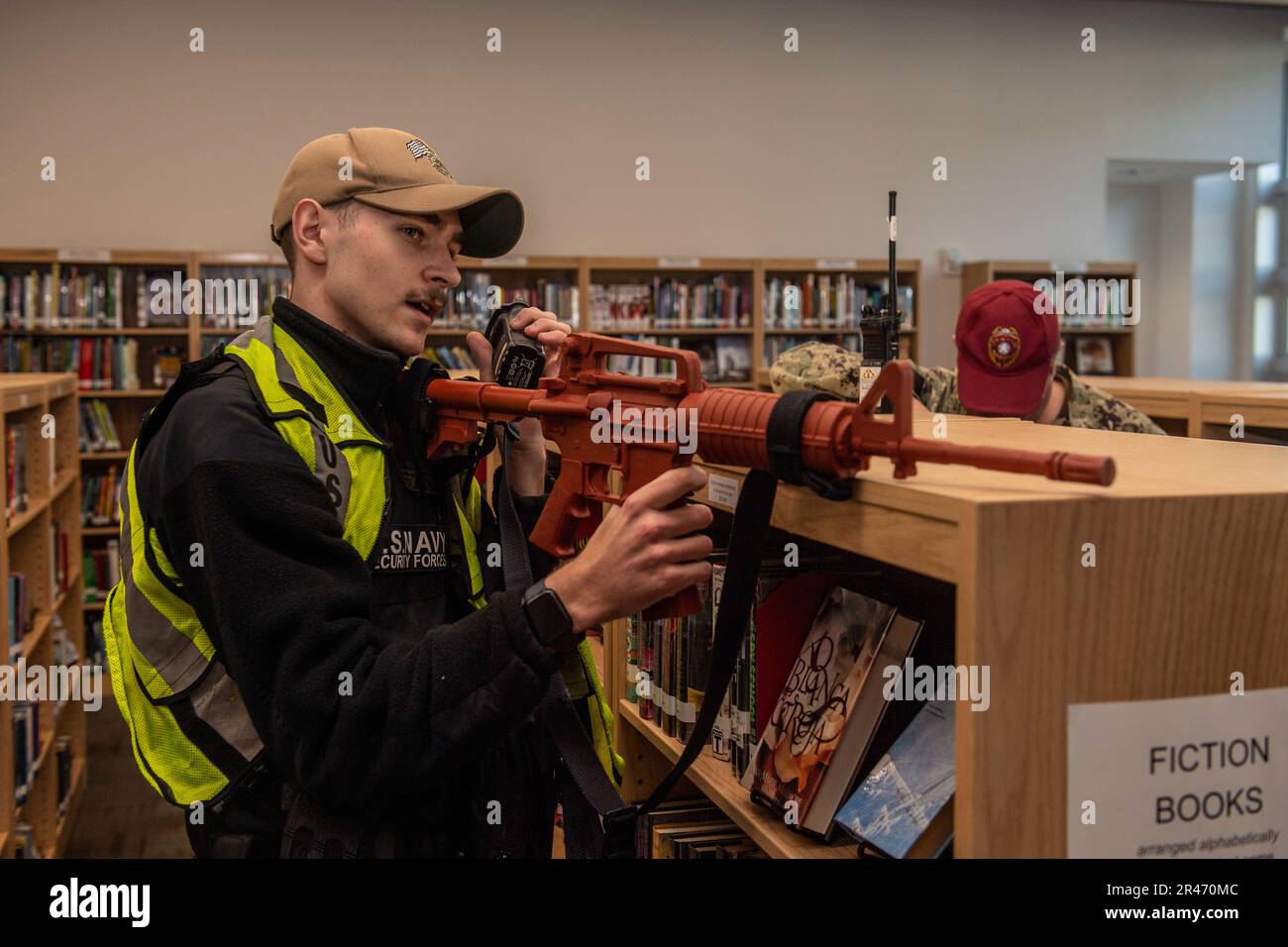 Master-at-Arms 3rd Class Spencer Yeich makes radio reports while ...