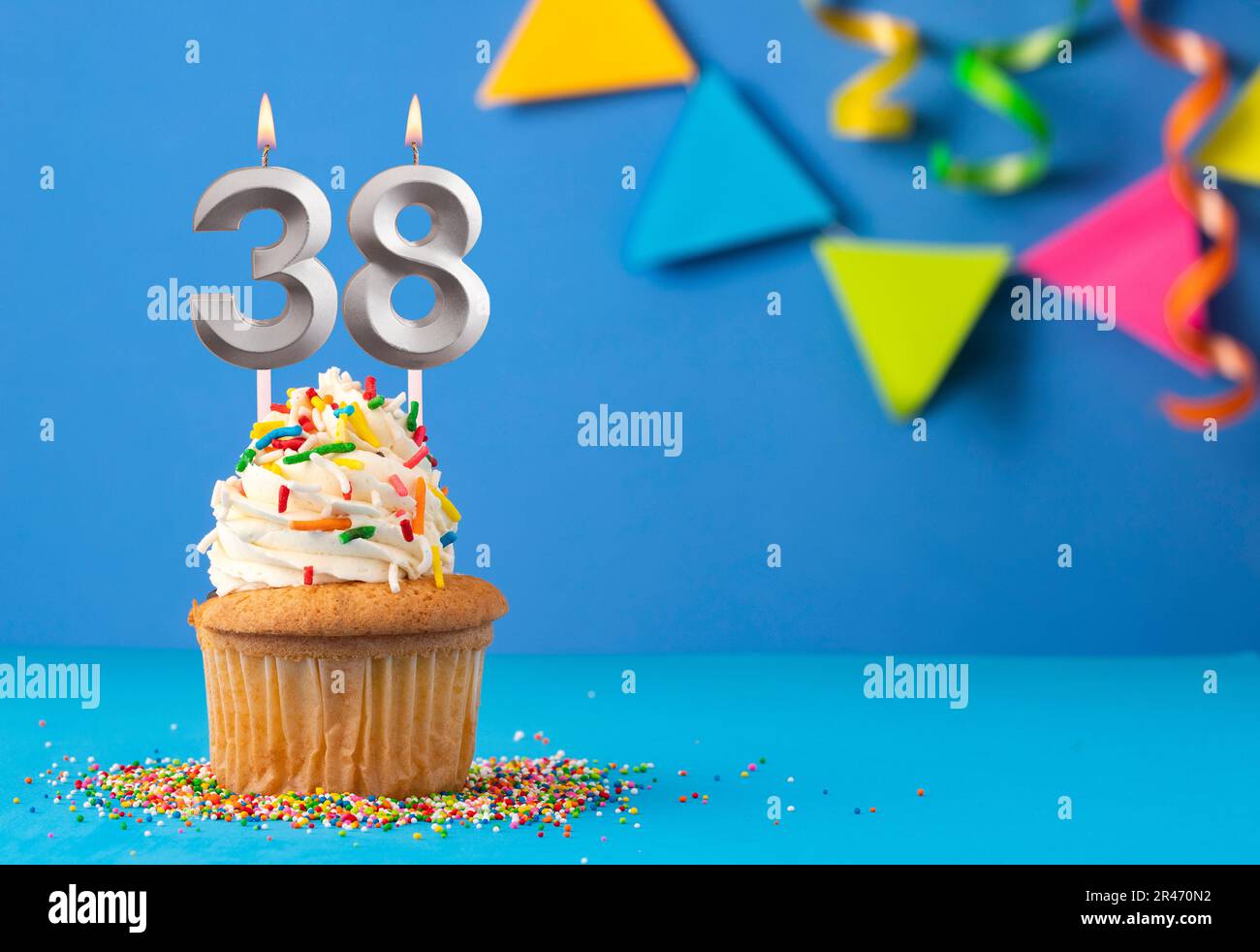 Candle number 38 - Cake birthday in blue background Stock Photo - Alamy