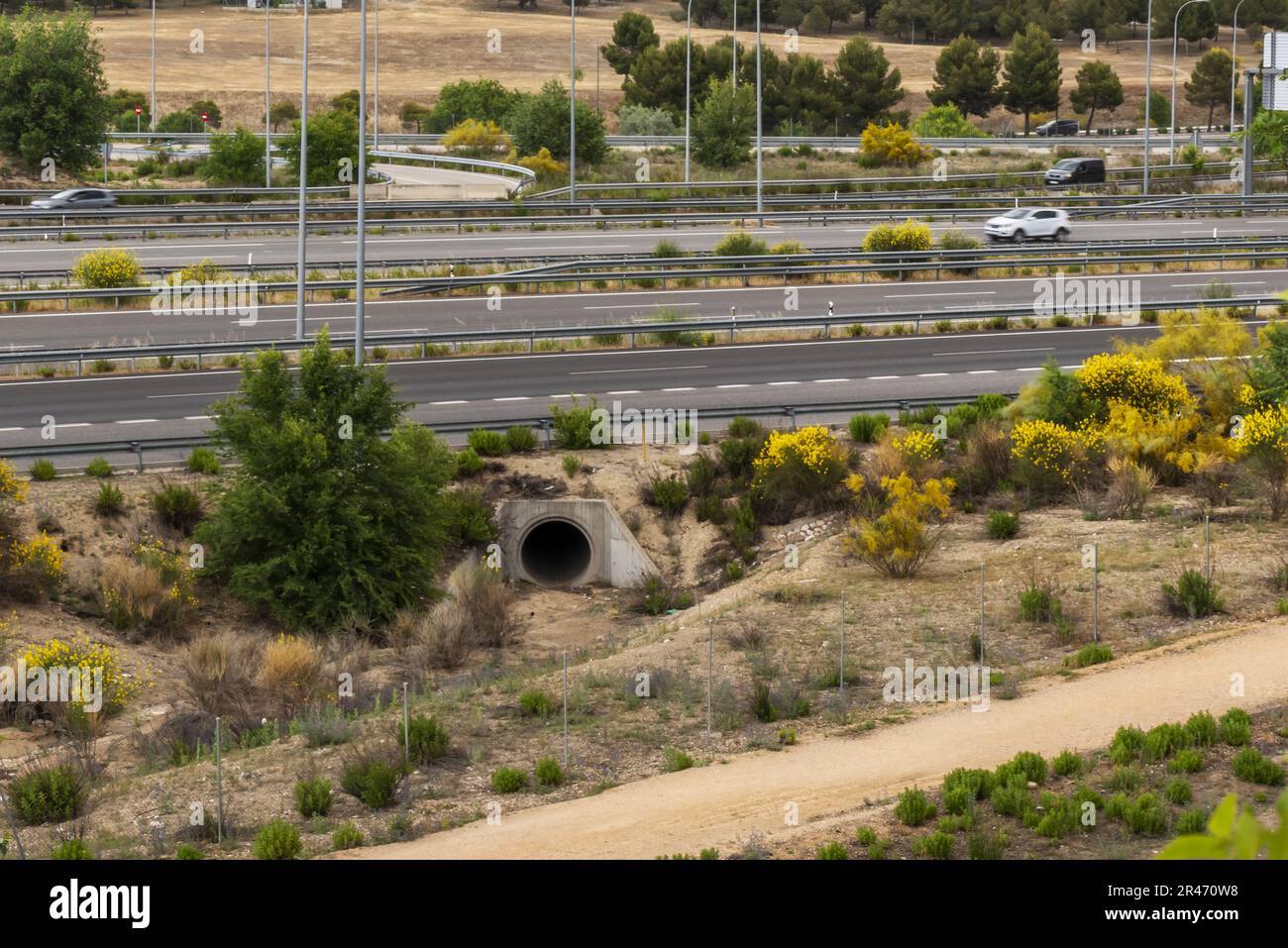 A drainage pipe under the multi-lane highway Stock Photo - Alamy
