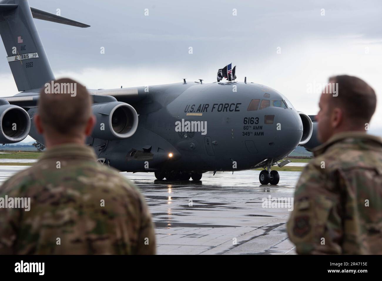 U.S. Air Force Col. Derek Salmi, left, 60th Air Mobility Wing commander ...