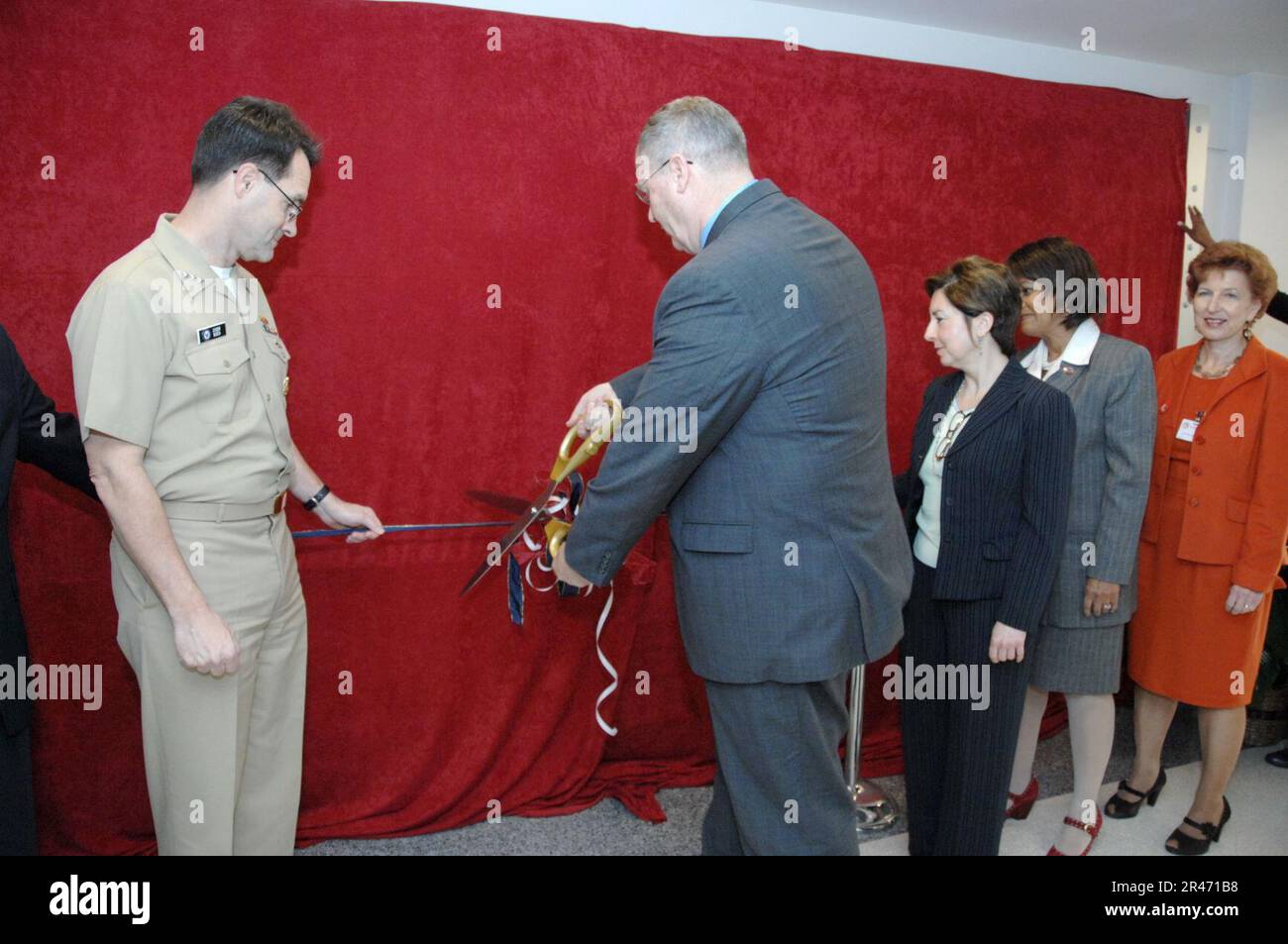 Under Secretary of the Navy Robert O. Work cut the ceremonial ribbon ...