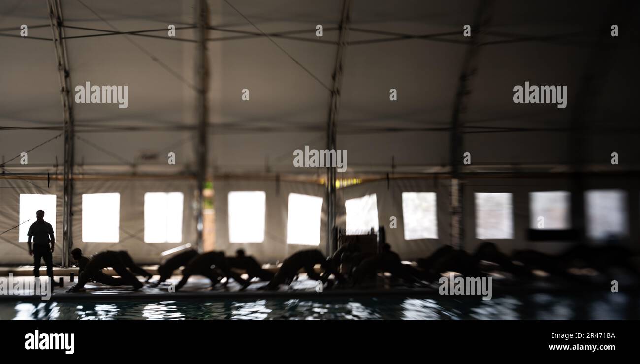 Special warfare candidates perform swim tactics and team building ...